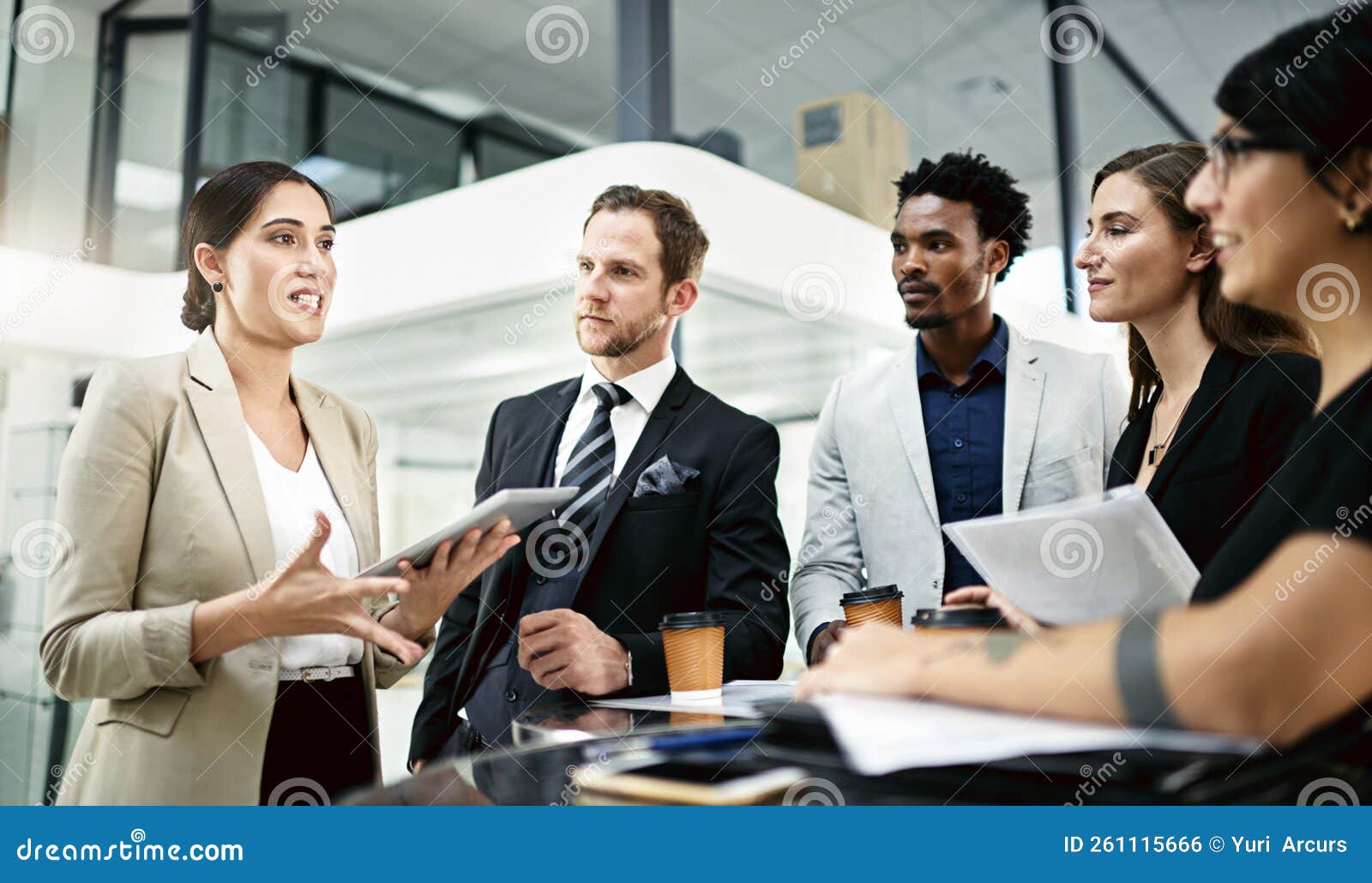Is Everyone on the Same Page. a Group of Businesspeople Looking at a ...