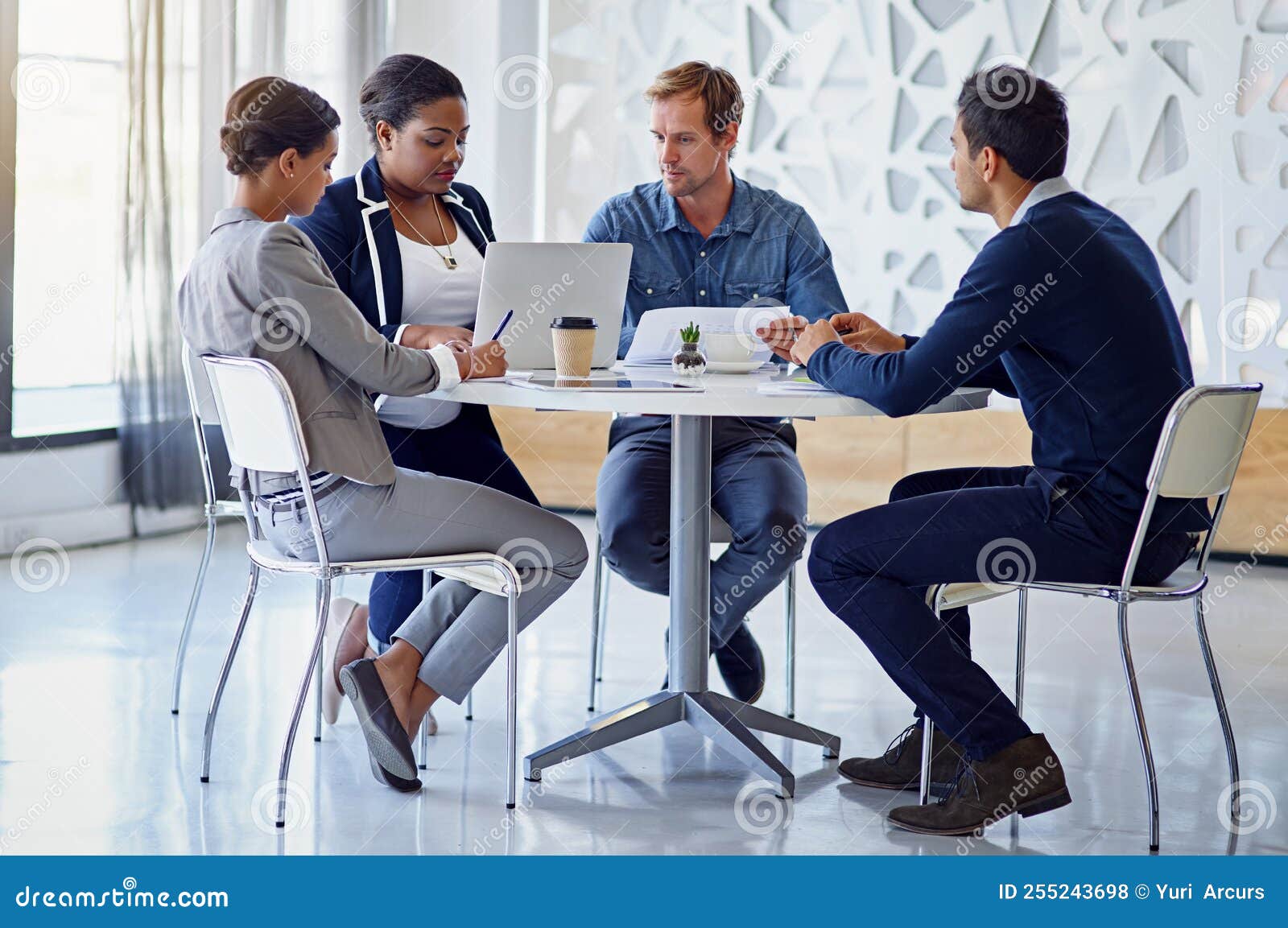 Is Everyone on the Same Page. a Group of Coworkers Working Together on ...