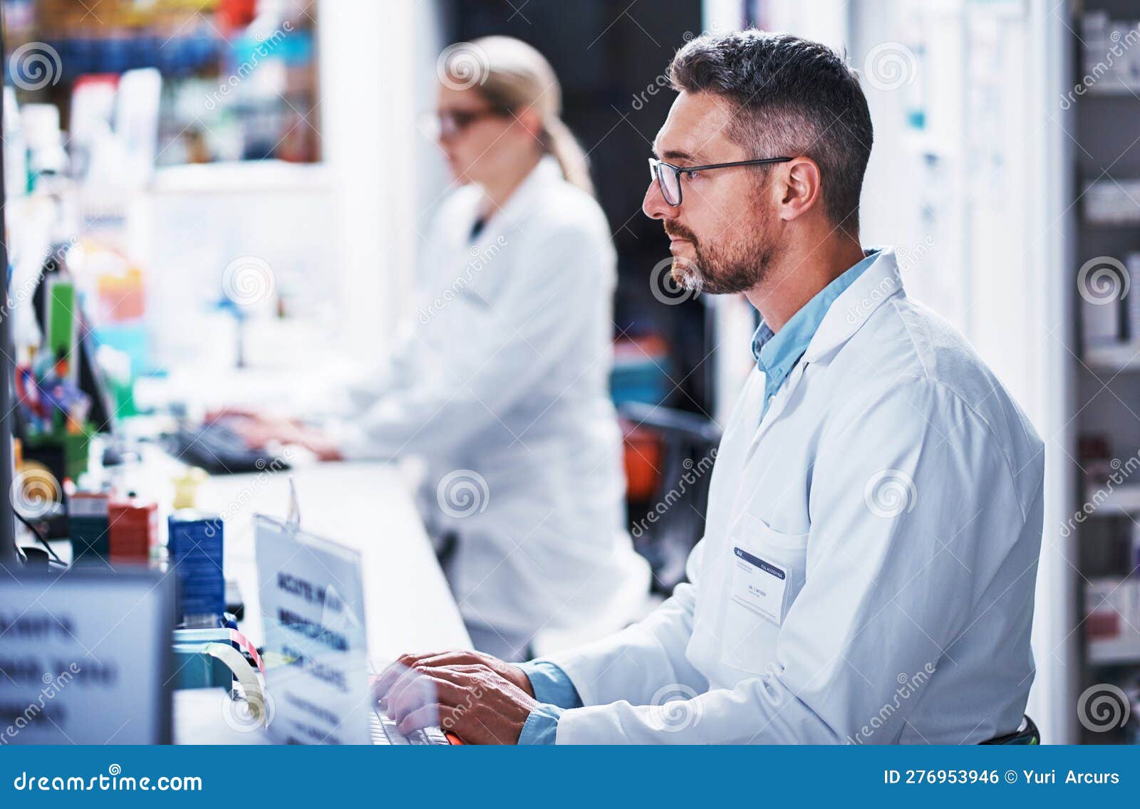 Everything is Digitized in this Pharmacy. a Mature Pharmacist Working ...