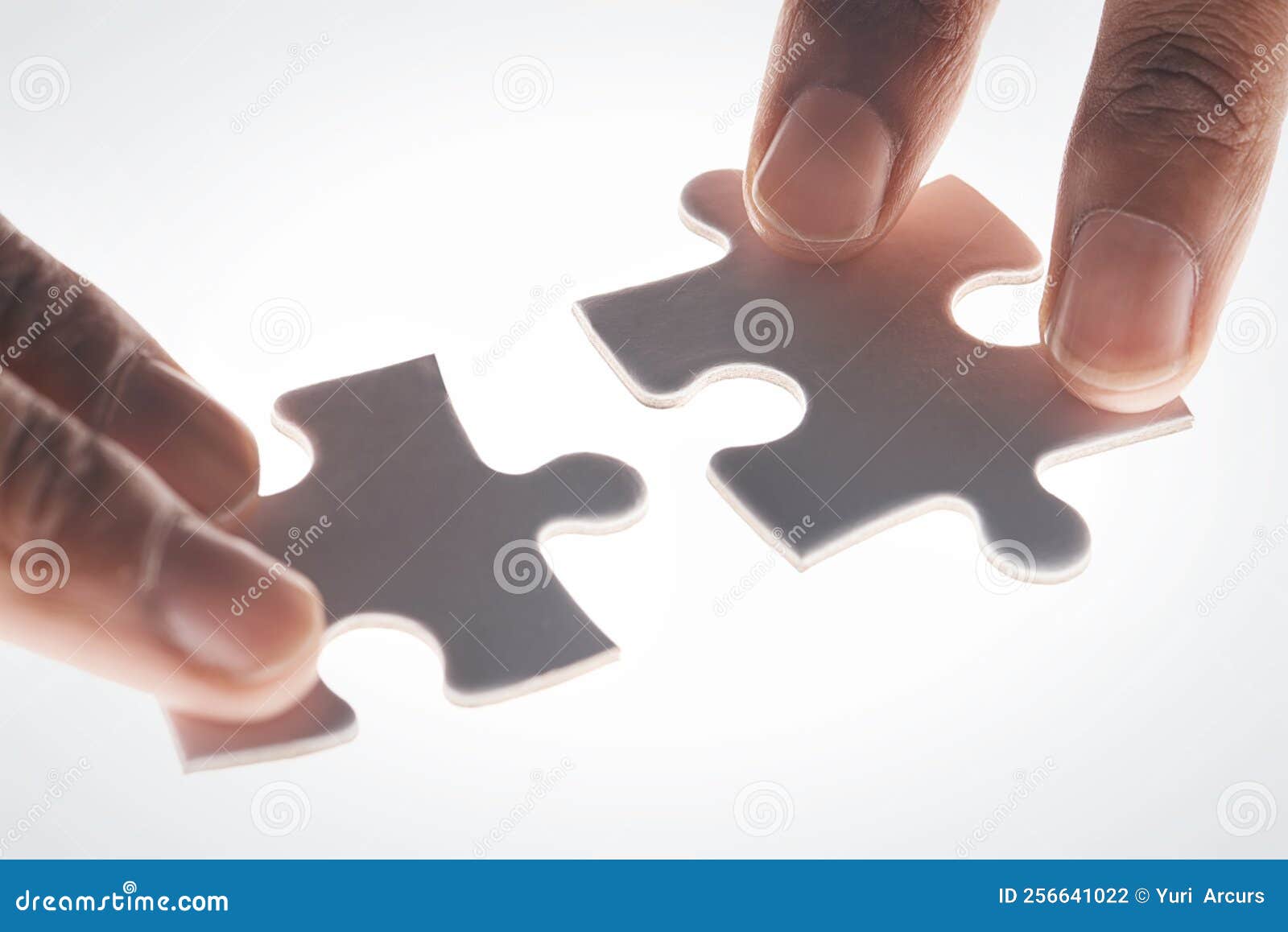 Everything is Falling into Place. Hands Holding Two Puzzle Pieces ...