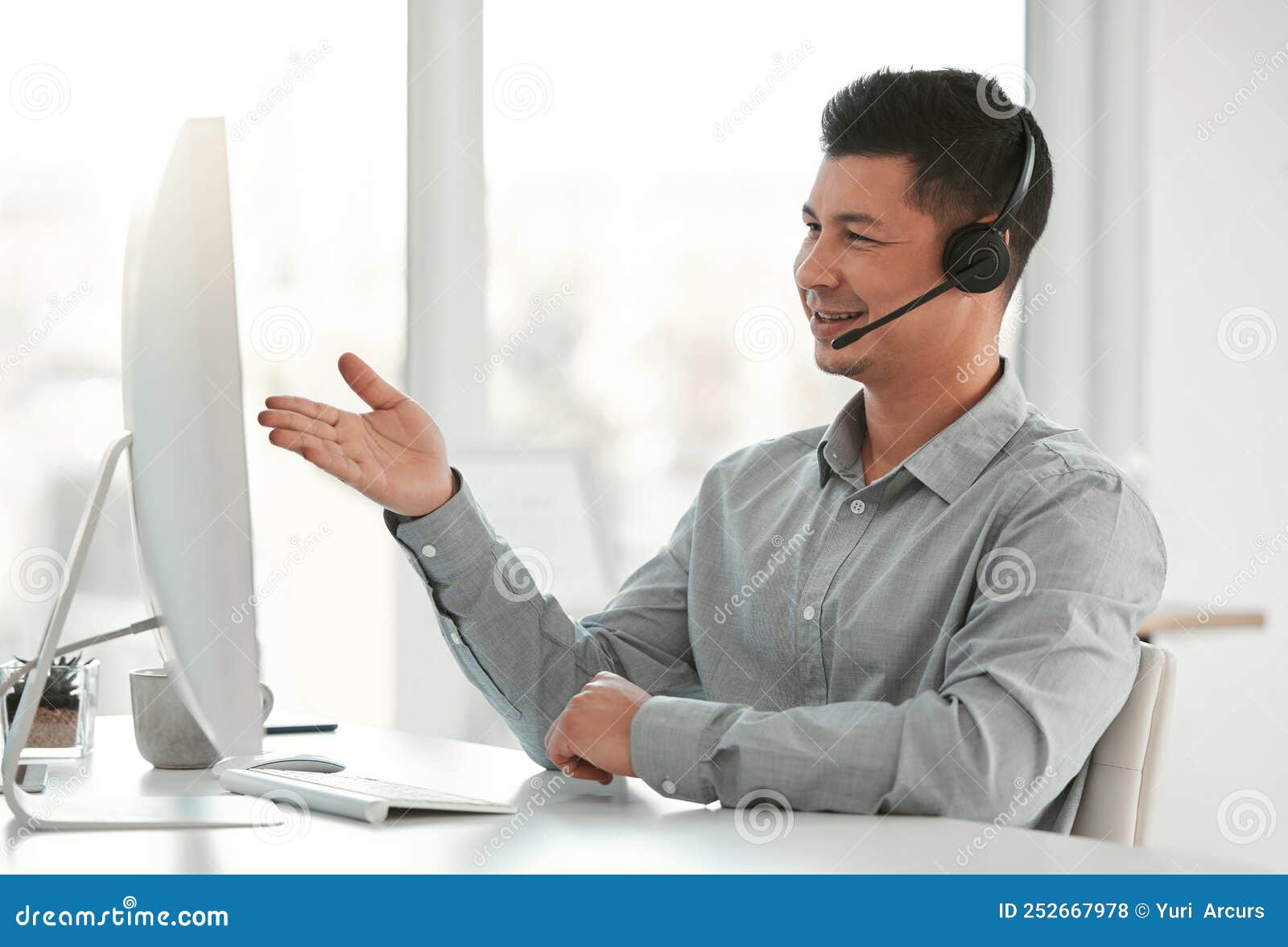 Everything Seems To Be in Order. a Young Male Call Center Agent Using a ...