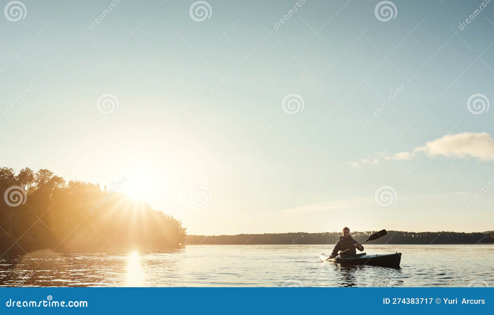 Everything You Need. a Young Man Kayaking on a Lake Outdoors. Stock ...