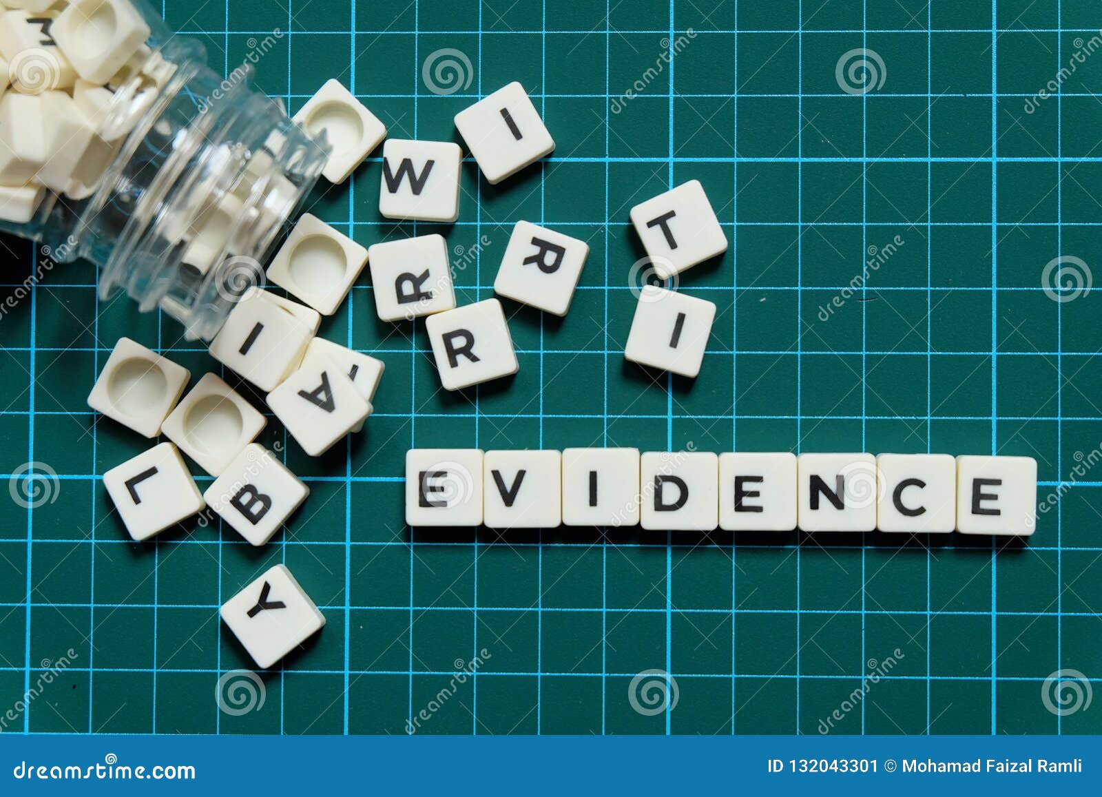 EVIDENCE - Word Written On Wooden Blocks On Light Blue Background ...