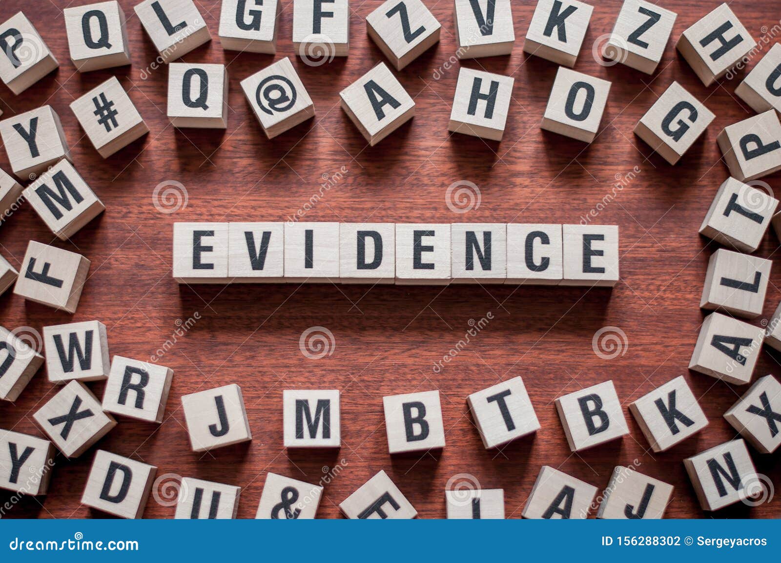 EVIDENCE - Word Written On Wooden Blocks On Light Blue Background ...