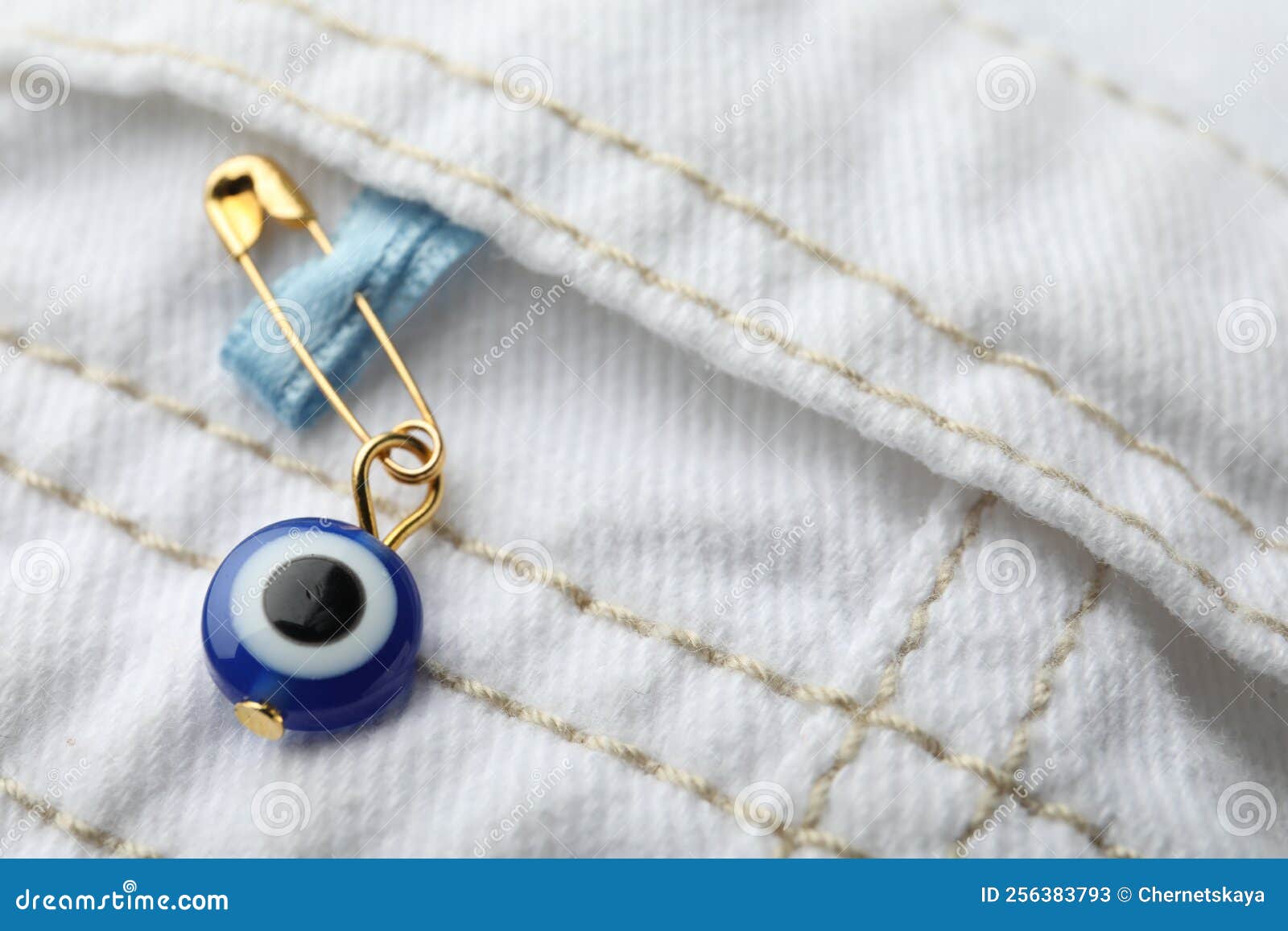 Evil Eye Safety Pin on Clothing, Closeup Stock Image - Image of arabic ...