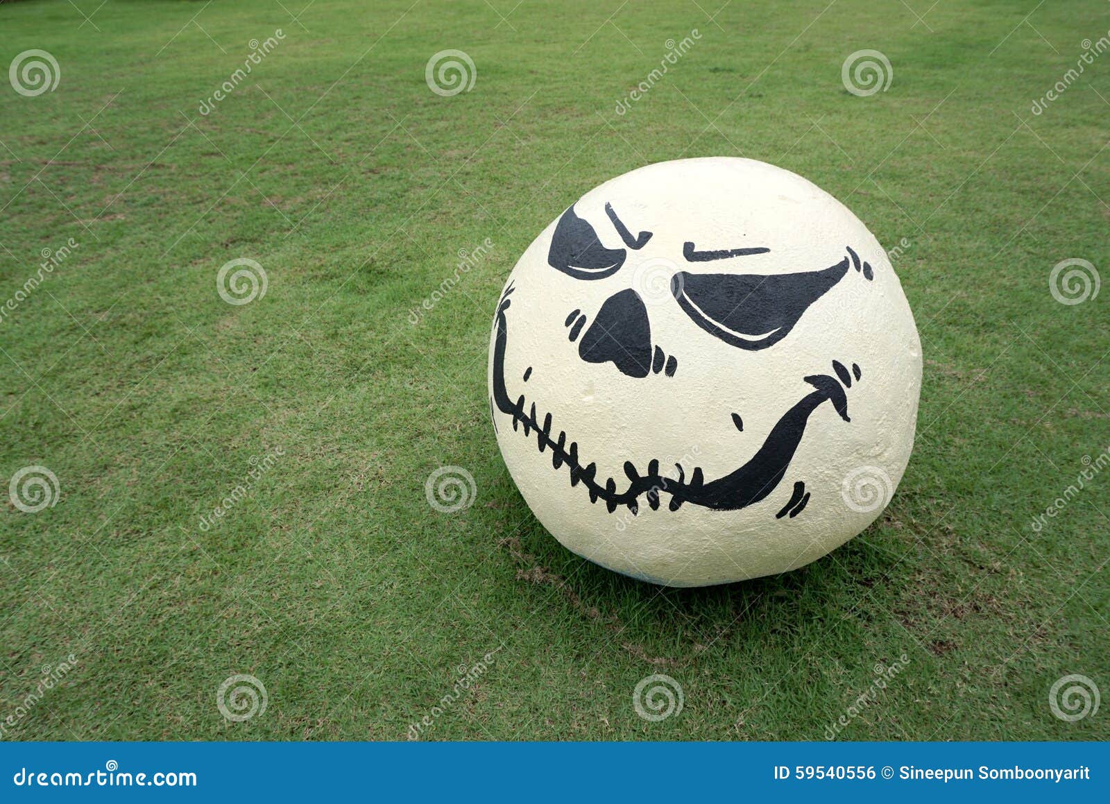 Evil Face Painted on Round Stone Stock Photo - Image of green ...