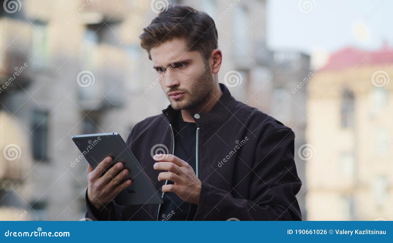 Evil Guy Having Video Call Outside. Angry Man Using Tablet Outdoors ...