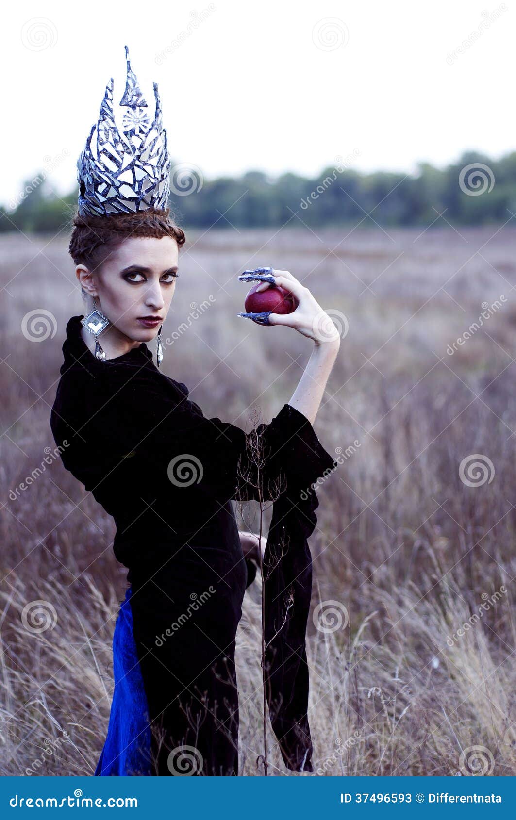 Evil queen with an apple stock image. Image of fiction - 37496593