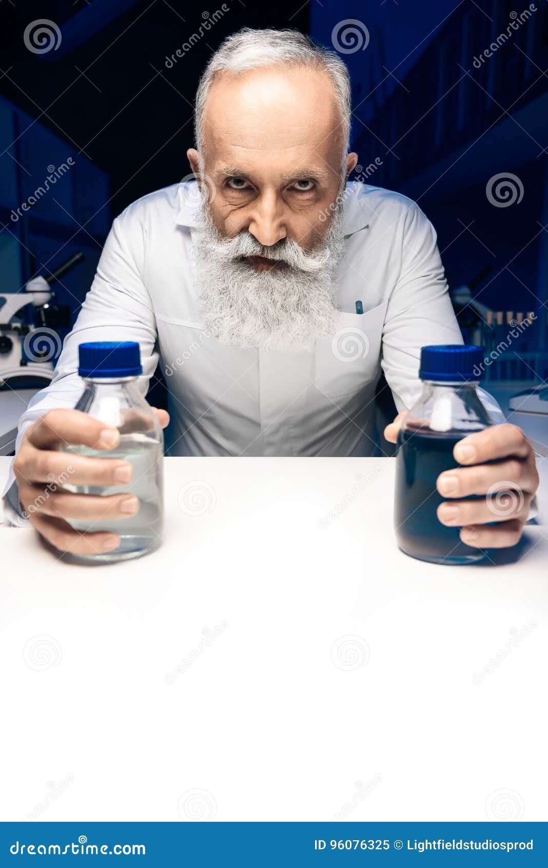 Evil Scientist with Bottles with Reagents Looking at Camera at ...