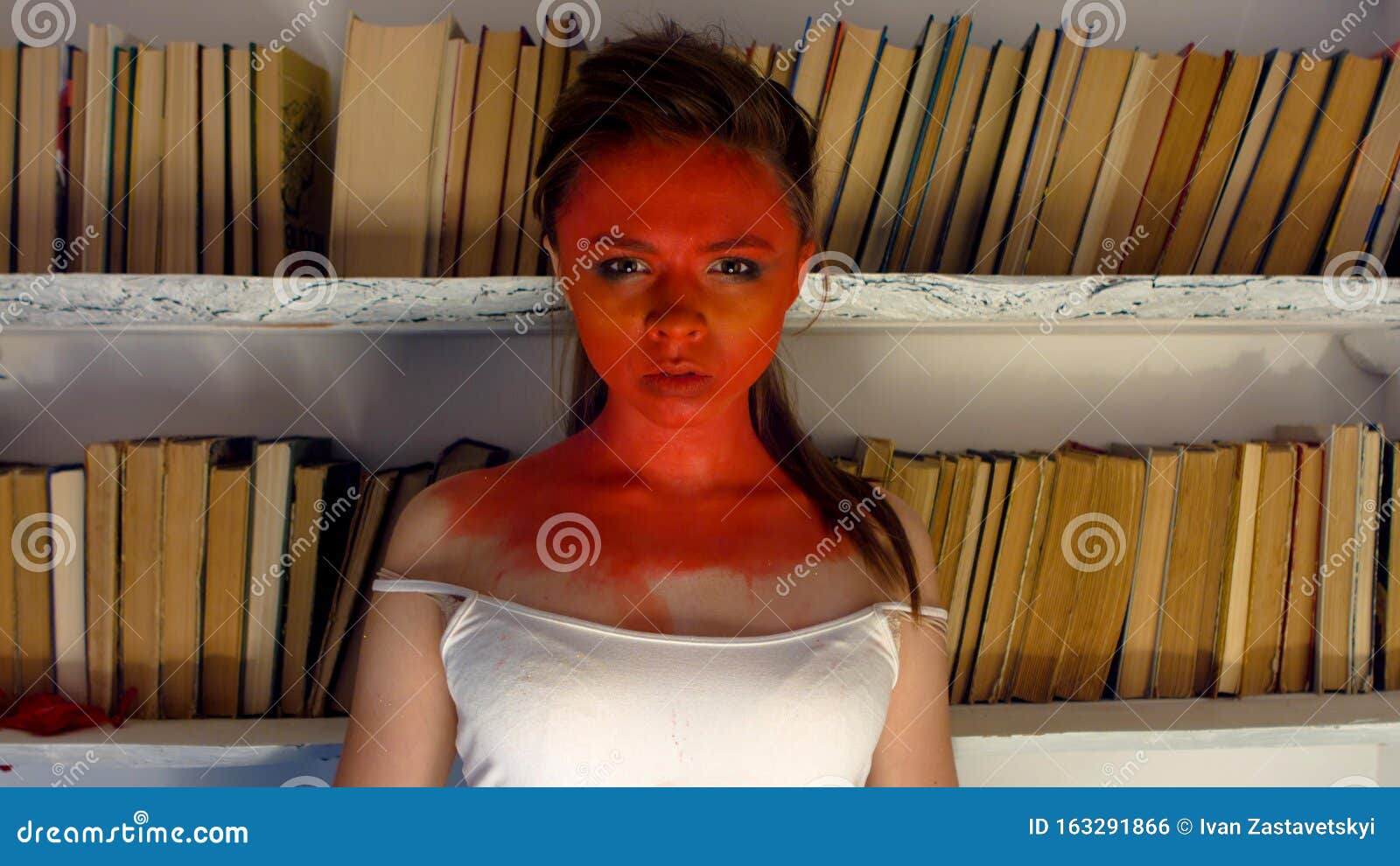 Evil Woman with a Red Clock Face Shows Delayed for Man Stock Photo ...
