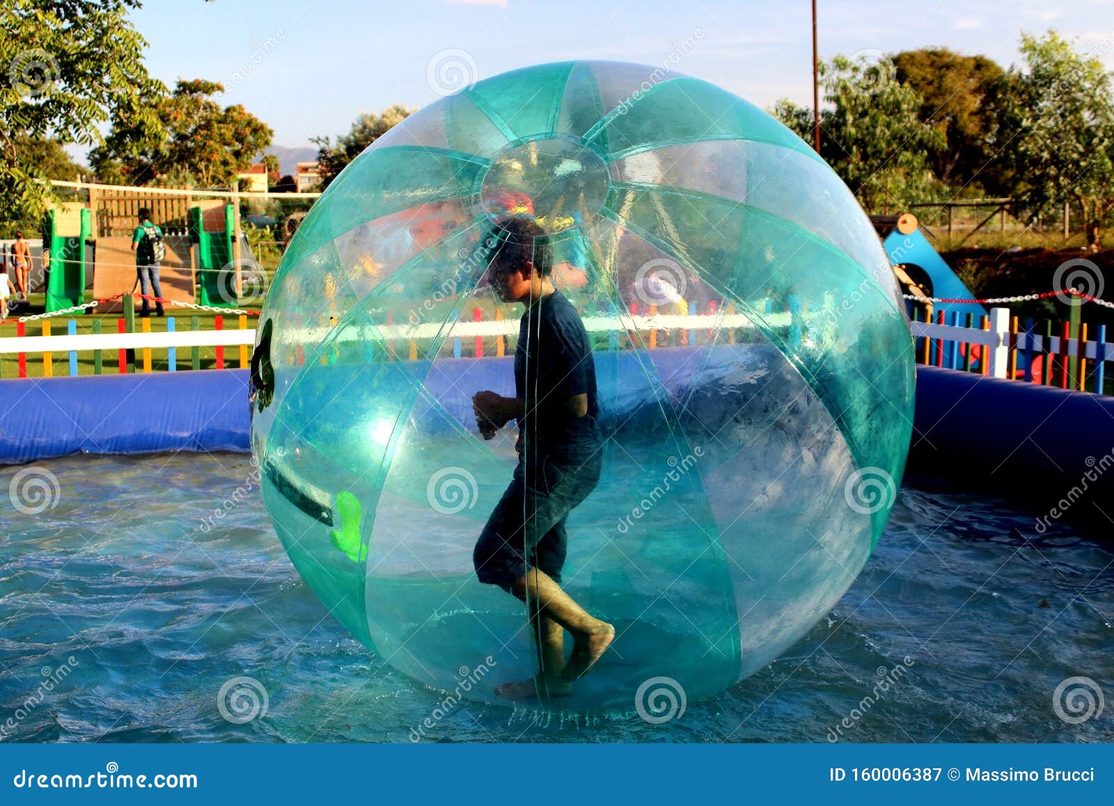 Child Having Fun Inside the Inflatable Ball Floating on the Water in ...