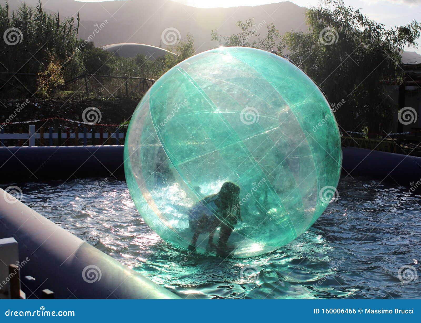 Child Having Fun Inside the Inflatable Ball Floating on the Water in ...