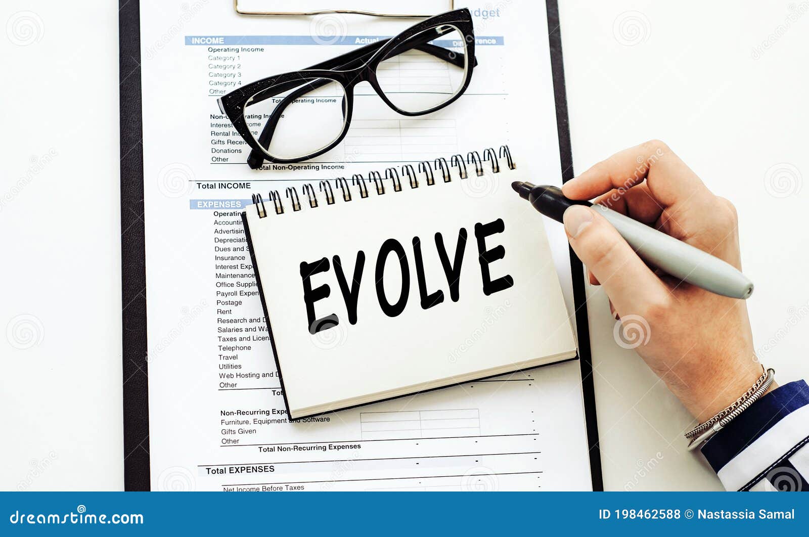 Evolve. Text on White Notepad on Documents Stock Photo - Image of ...