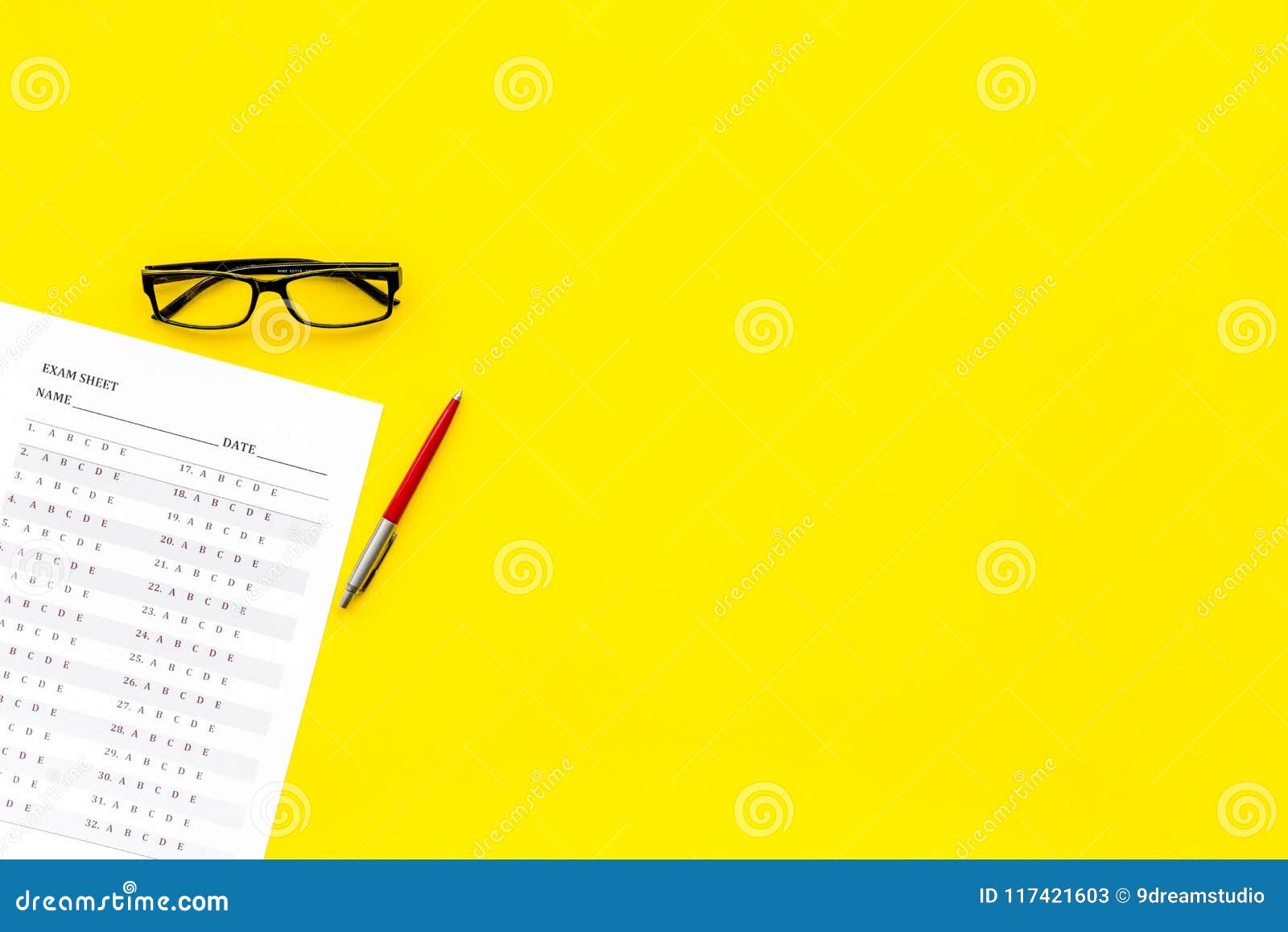 Exam Sheet on Yellow Table Flat Lay Copy Space. Education Concept Stock ...