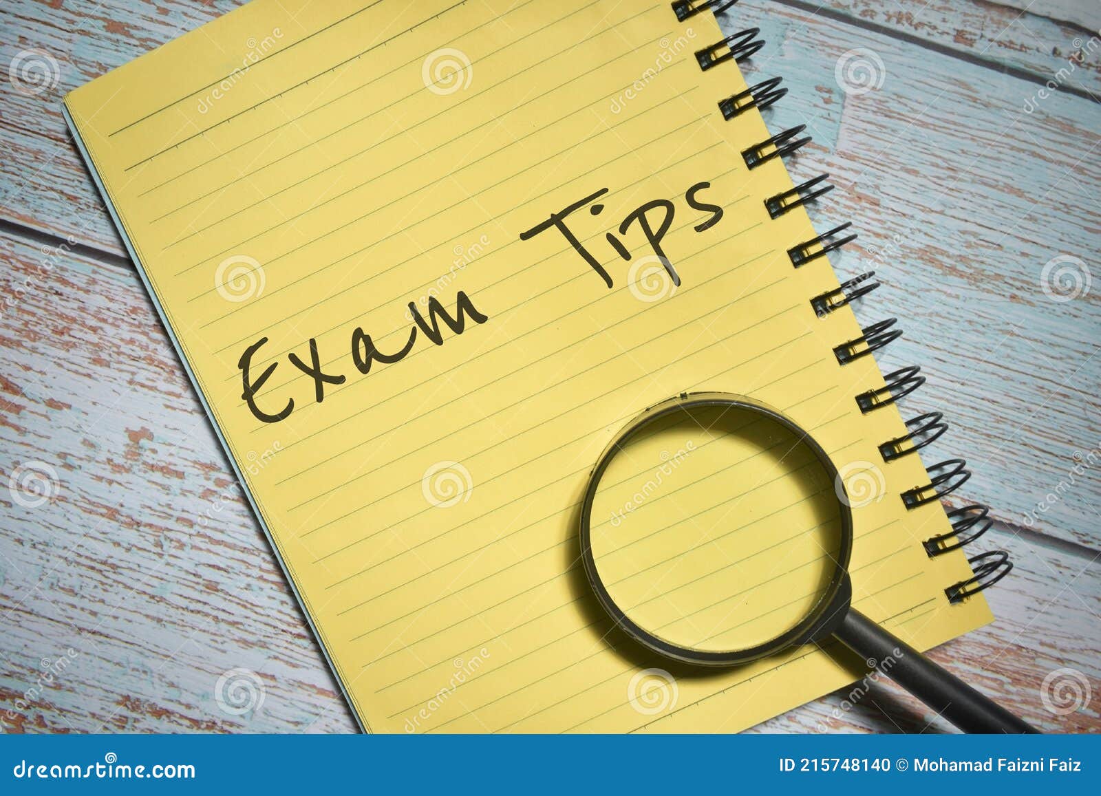 Exam Tips Wording with Magnifying Glass Over Yellow Paper Stock Photo ...