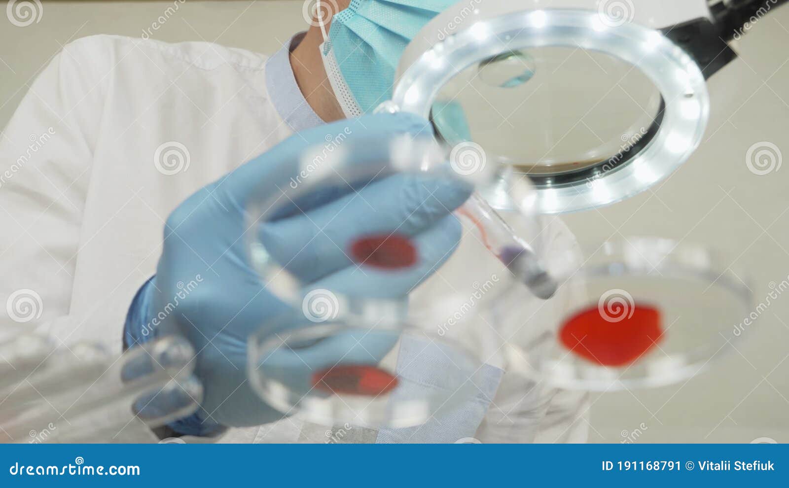 Examination of Blood Samples in a Laboratory Using a Microscope. Stock ...