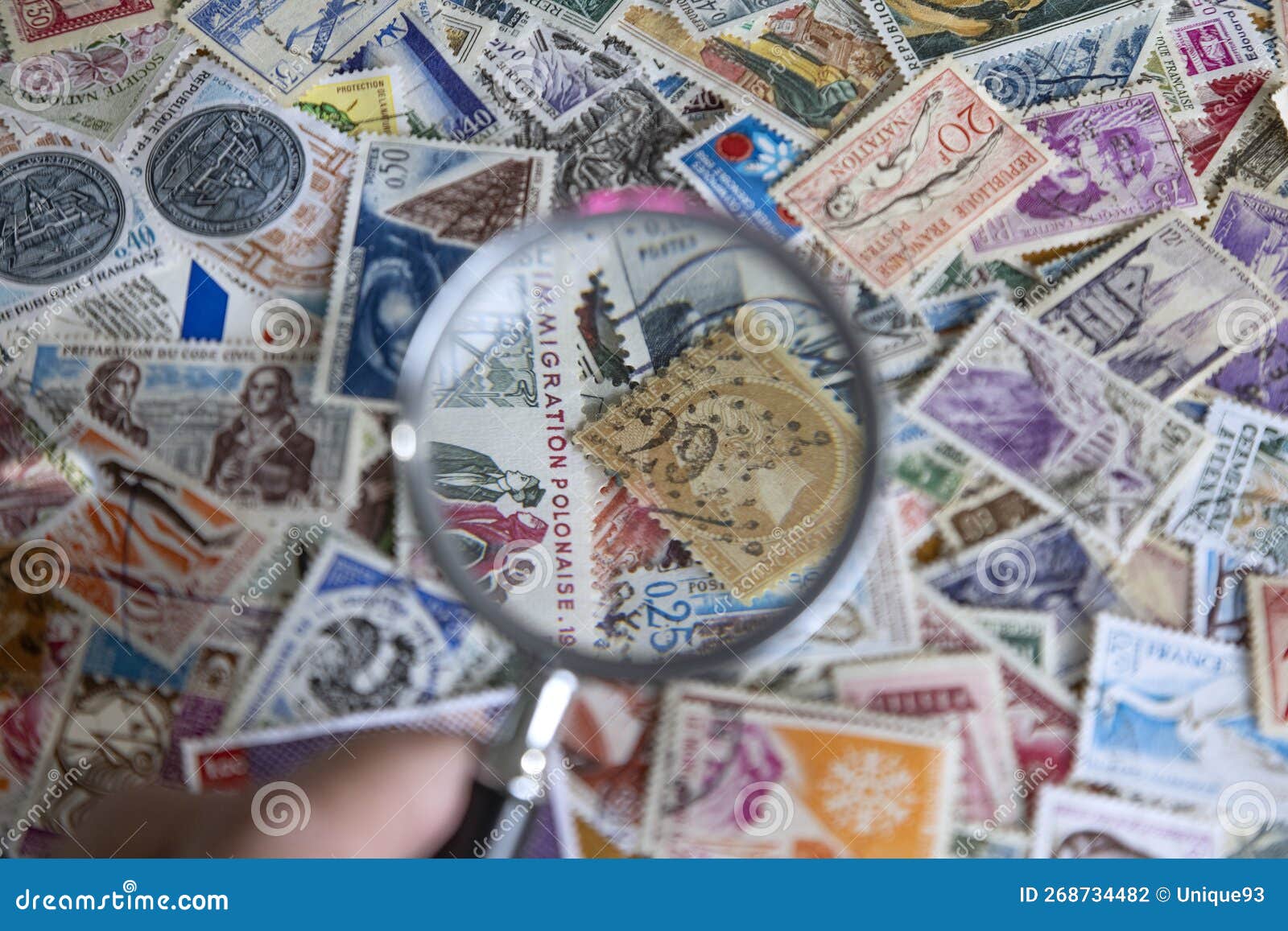 Examination with a Magnifying Glass of Old Postage Stamps Editorial ...
