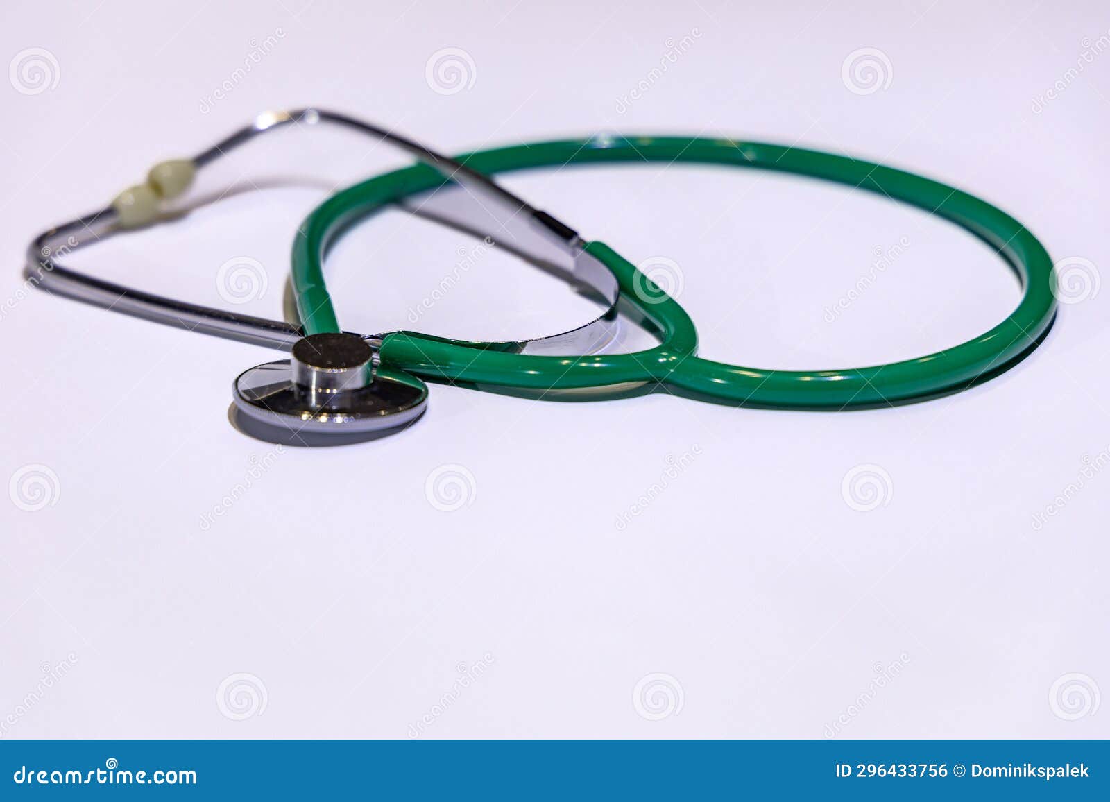 Examination with a Stethoscope Green Medical Stethoscope on the Table ...