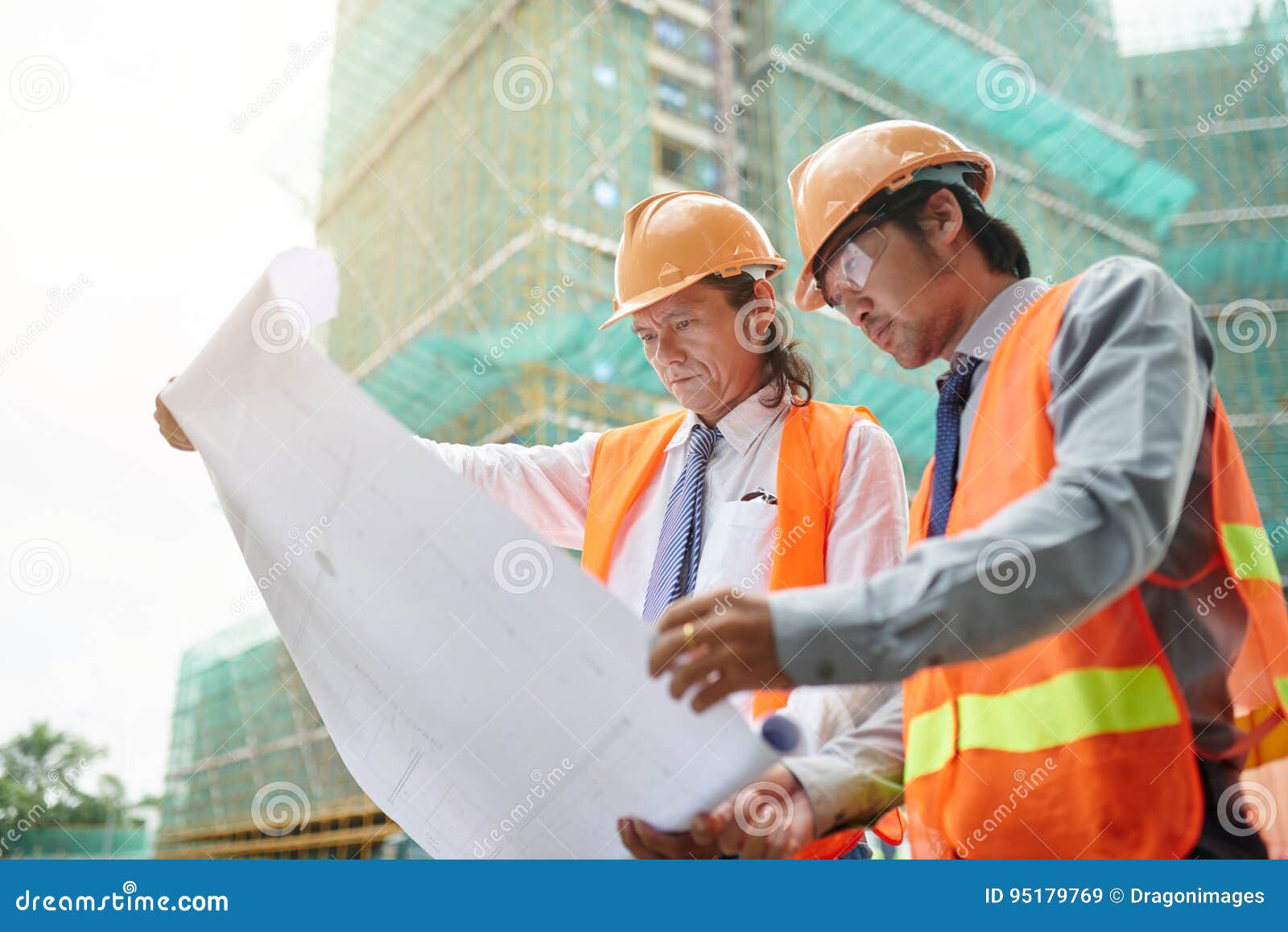 Examining blueprint stock image. Image of building, architect - 95179769