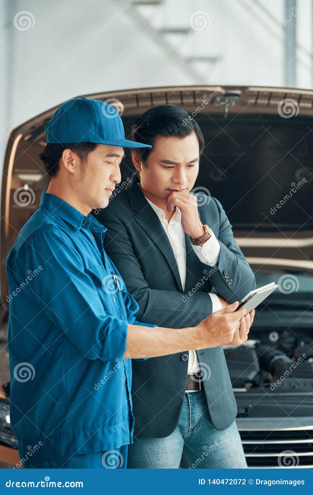 Examining the Car with Modern Technologies Stock Photo - Image of ...