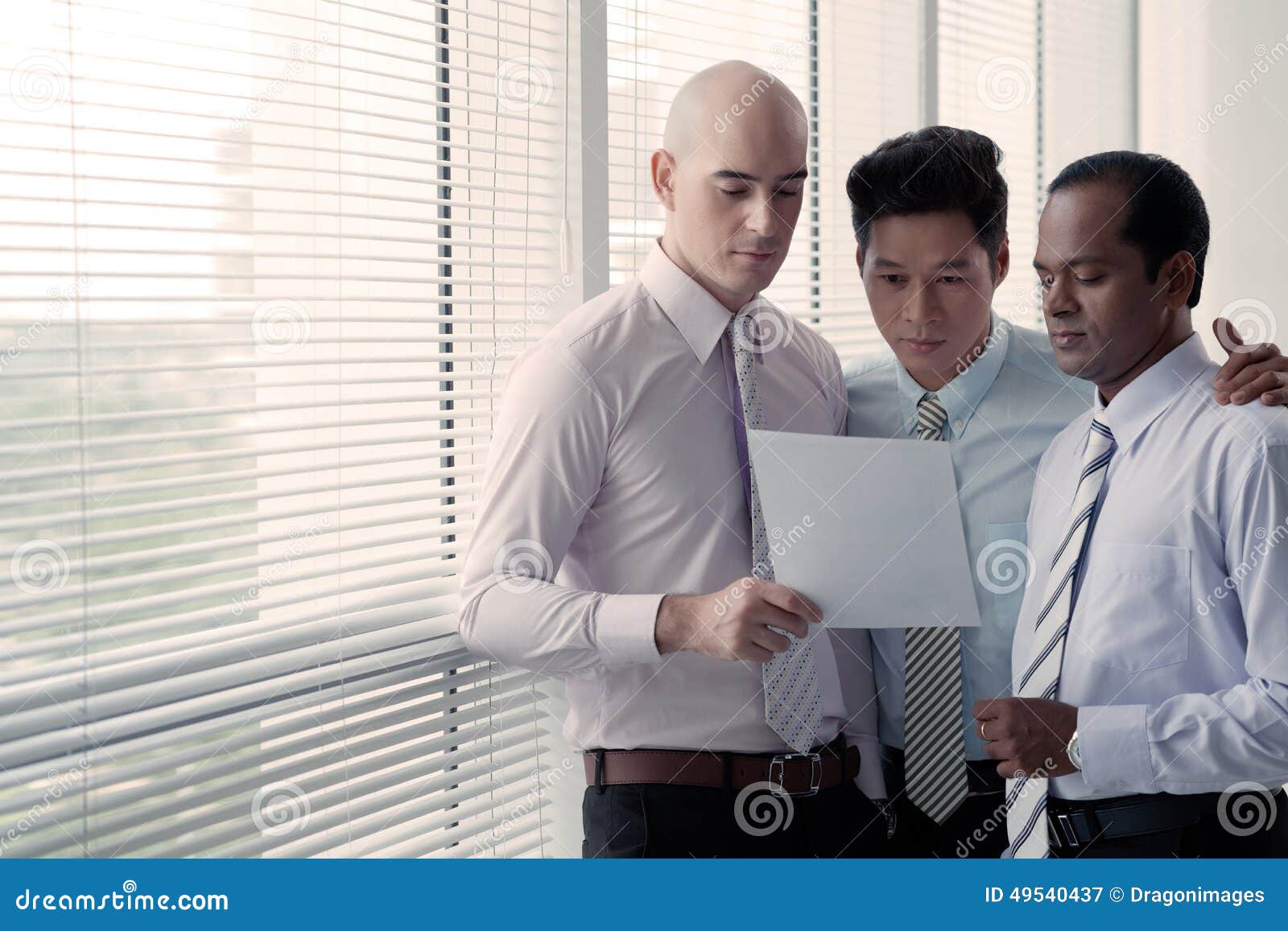 Examining a document stock image. Image of vietnamese - 49540437