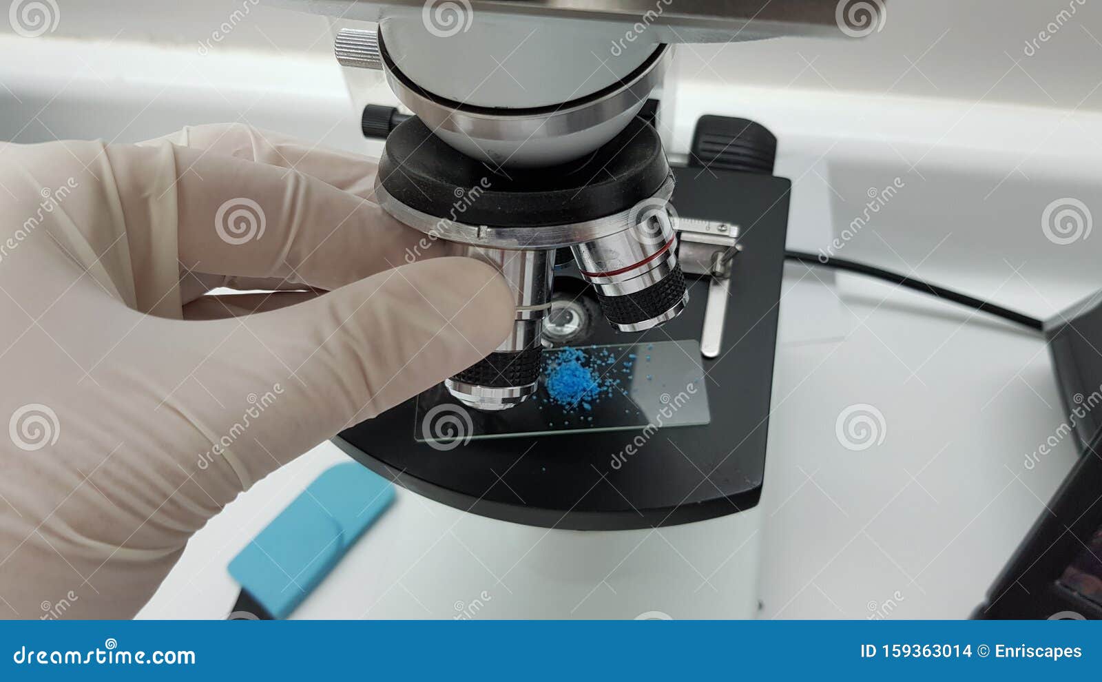 Examining a Sample Under a Microscope Stock Photo - Image of microscope ...