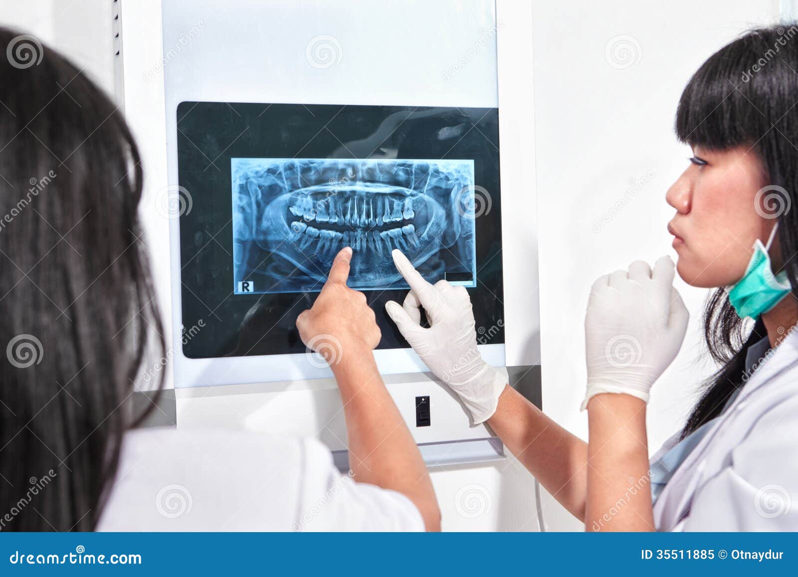 Examining teeth X Ray stock image. Image of asian, consultation - 35511885