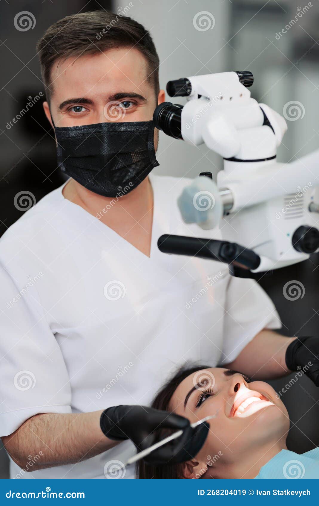 Examining Thoroughly. Upbeat Male Dentist Using a Professional ...