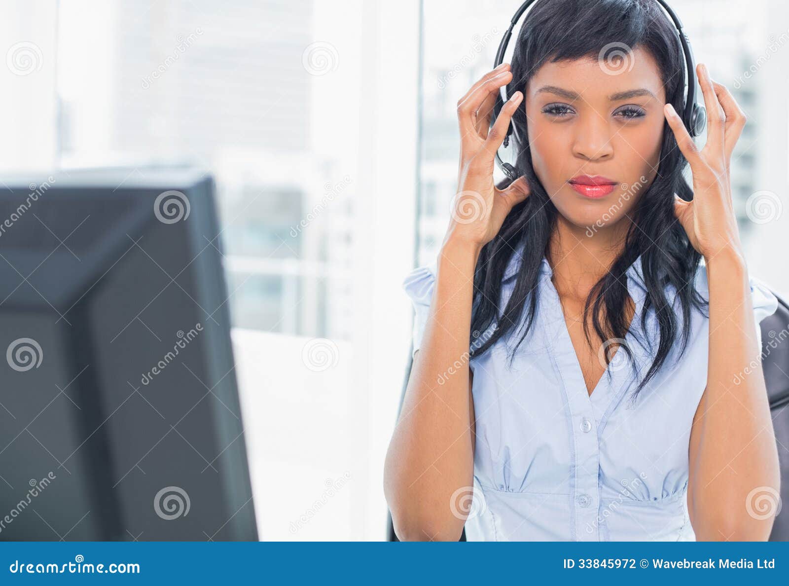 Exasperated Operator Looking at Camera Stock Photo - Image of sitting ...
