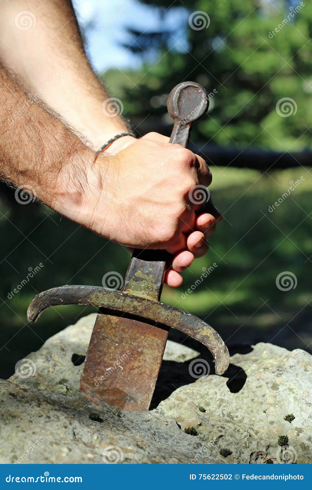 Sword In The Stone Near The Castle. Saint Arthur`s Style Medieval ...
