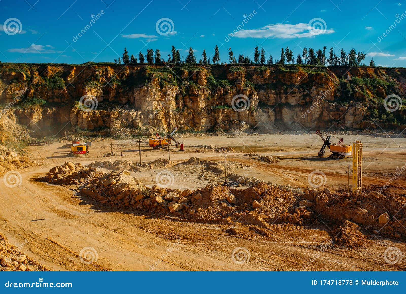 Excavarors Working on Limestone Mining in the Quarry Stock Photo ...