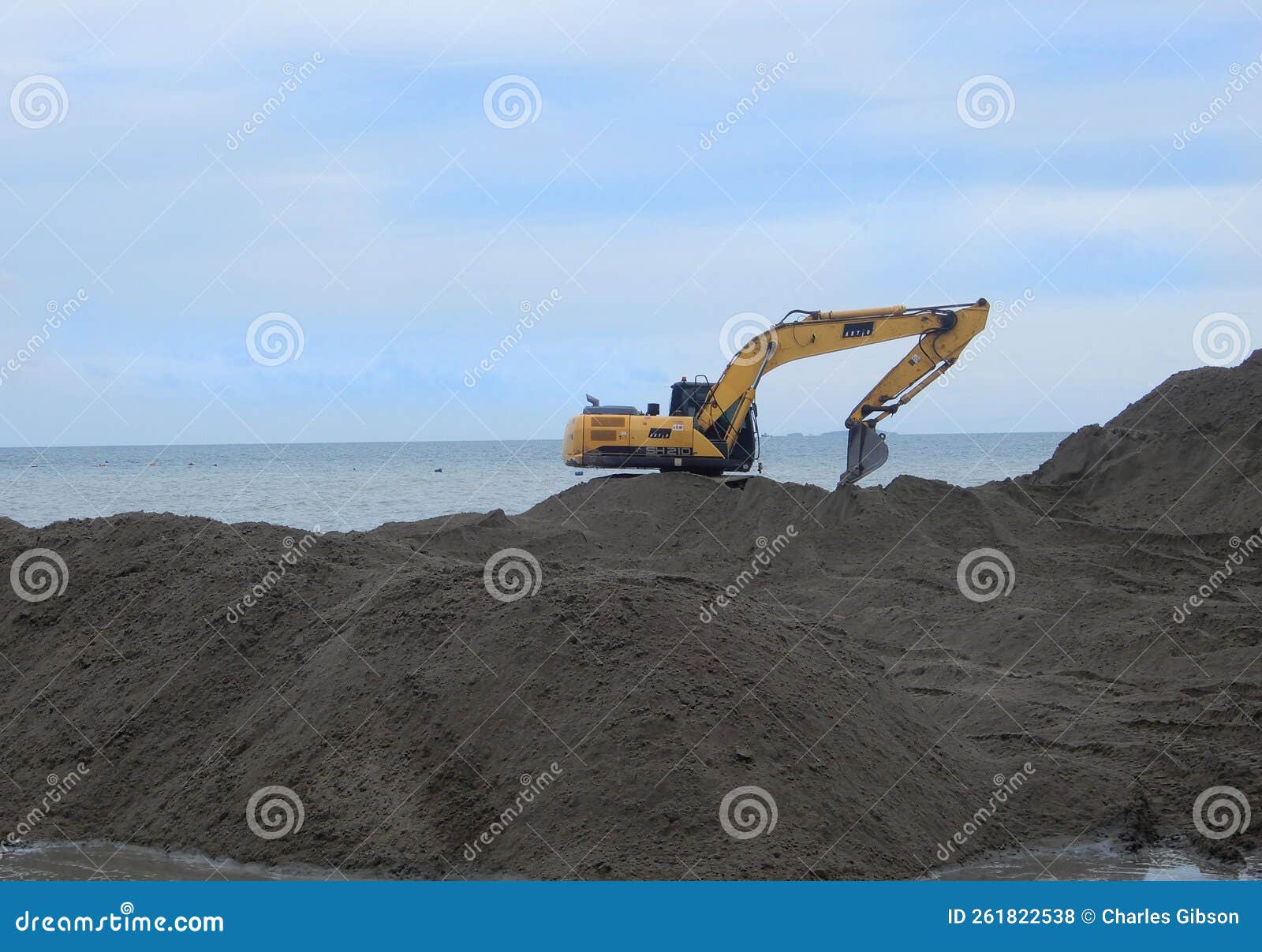 Excavator on beach sand editorial stock photo. Image of jomtien - 261822538
