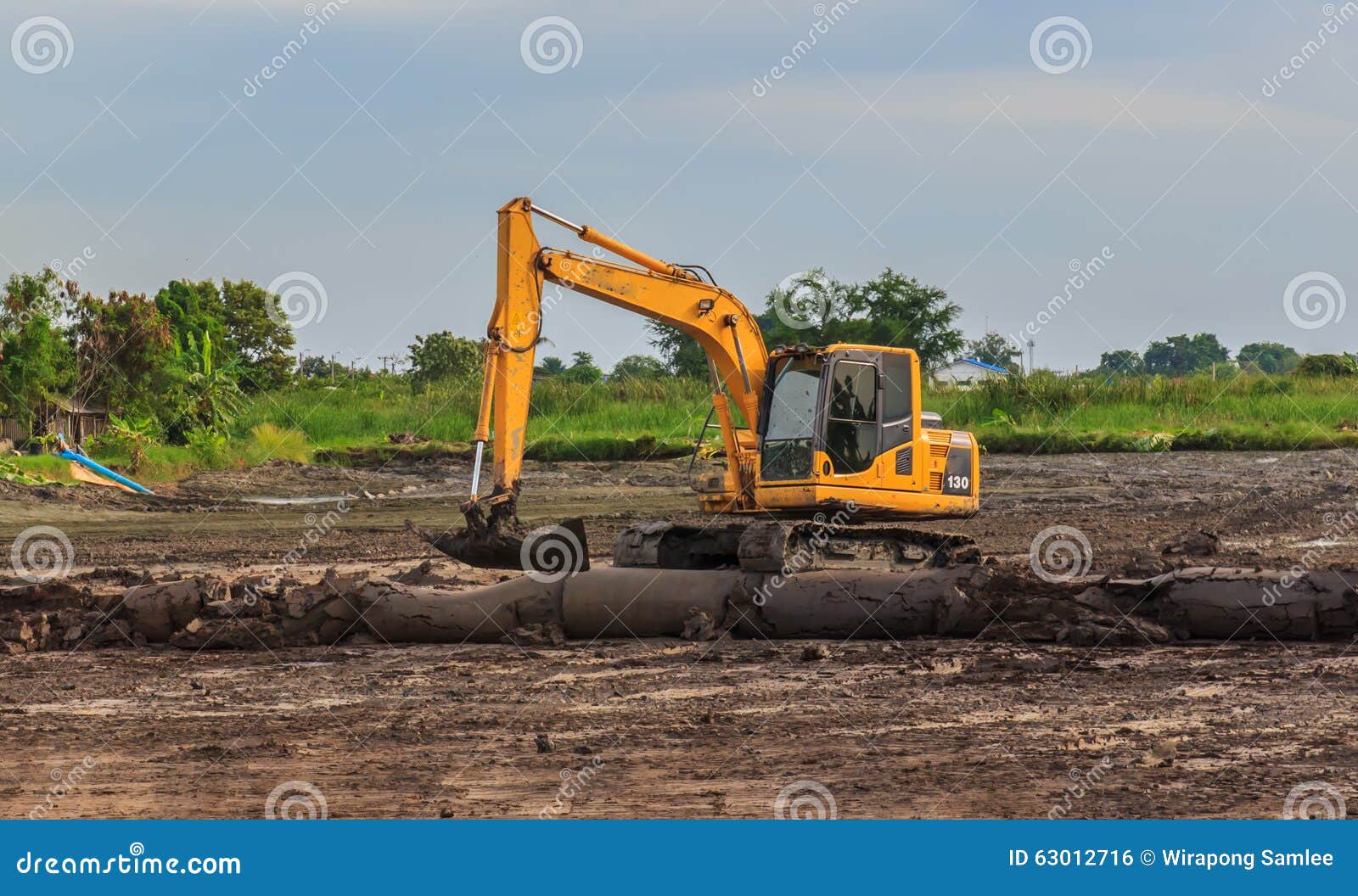 Excavator in action stock photo. Image of equipment, excavation - 63012716