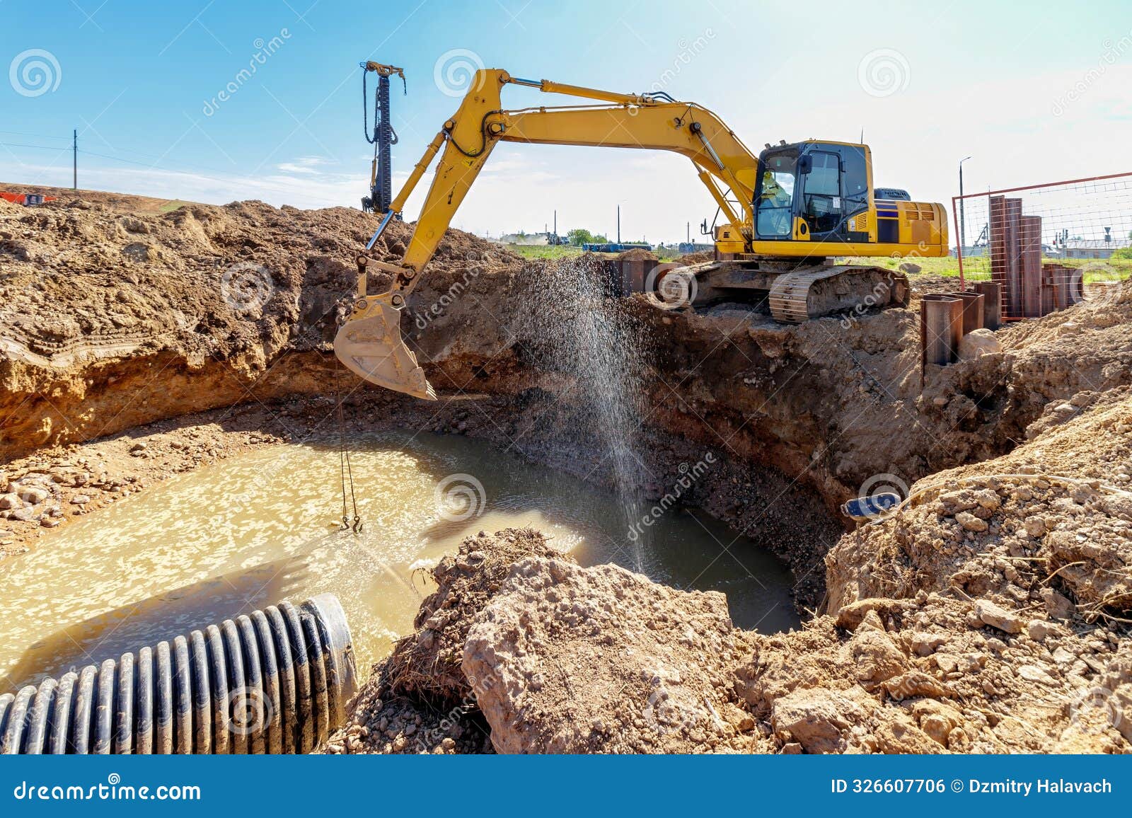 Excavator at a Construction Site Digging a Large Trench Stock Photo ...