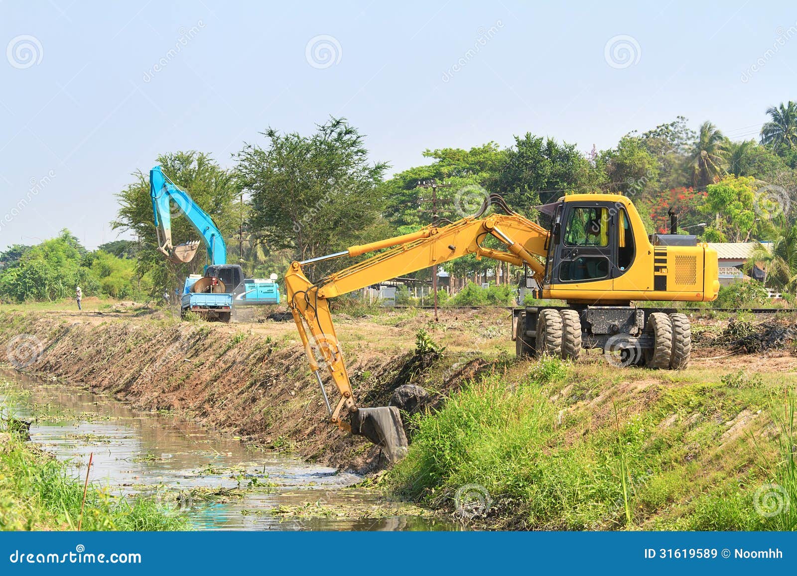 Excavator along river stock image. Image of rocks, canal - 31619589