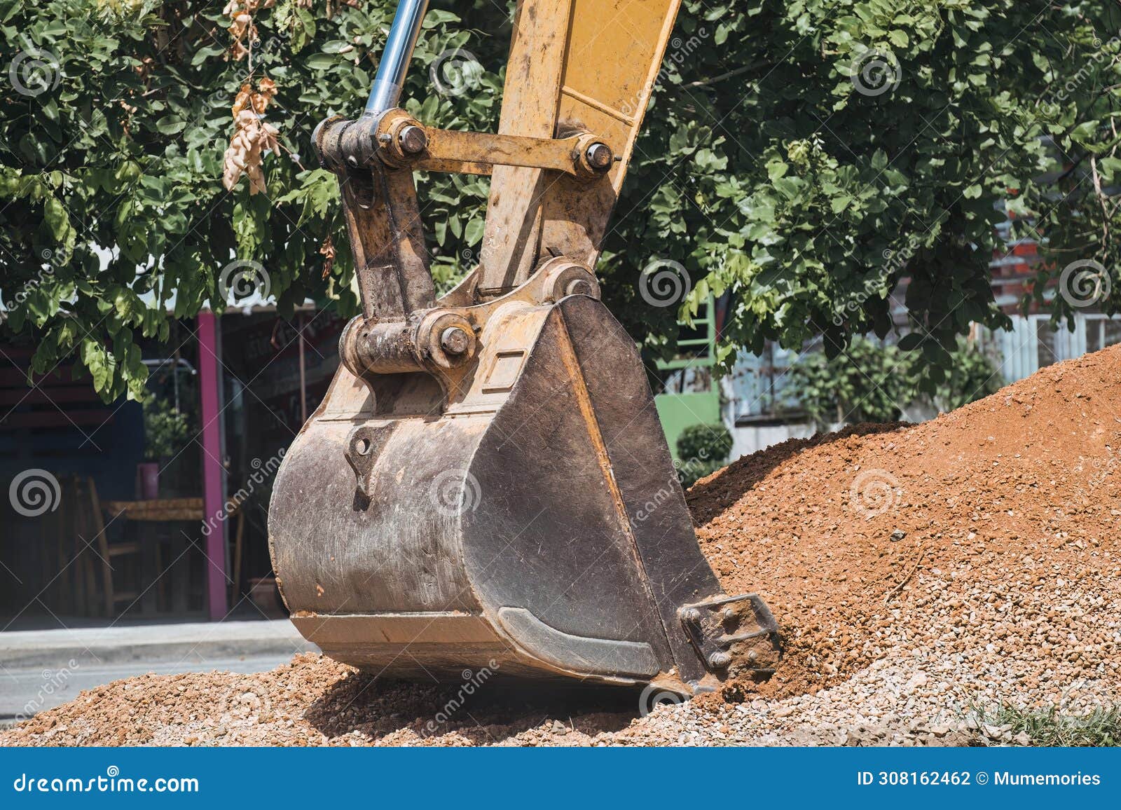 Excavator Digging Soil and Stone on Construction Site Stock Photo ...