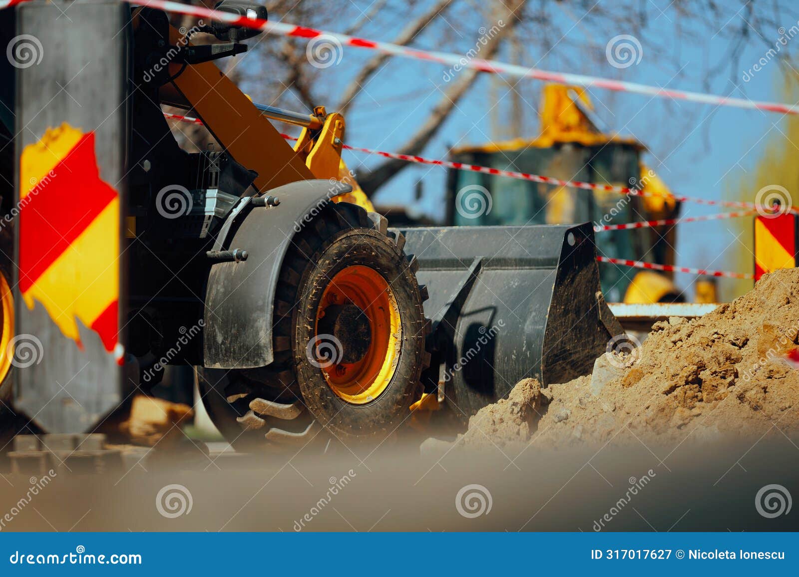 Excavator Behind a Warning Tape on a Construction Site Stock Image ...