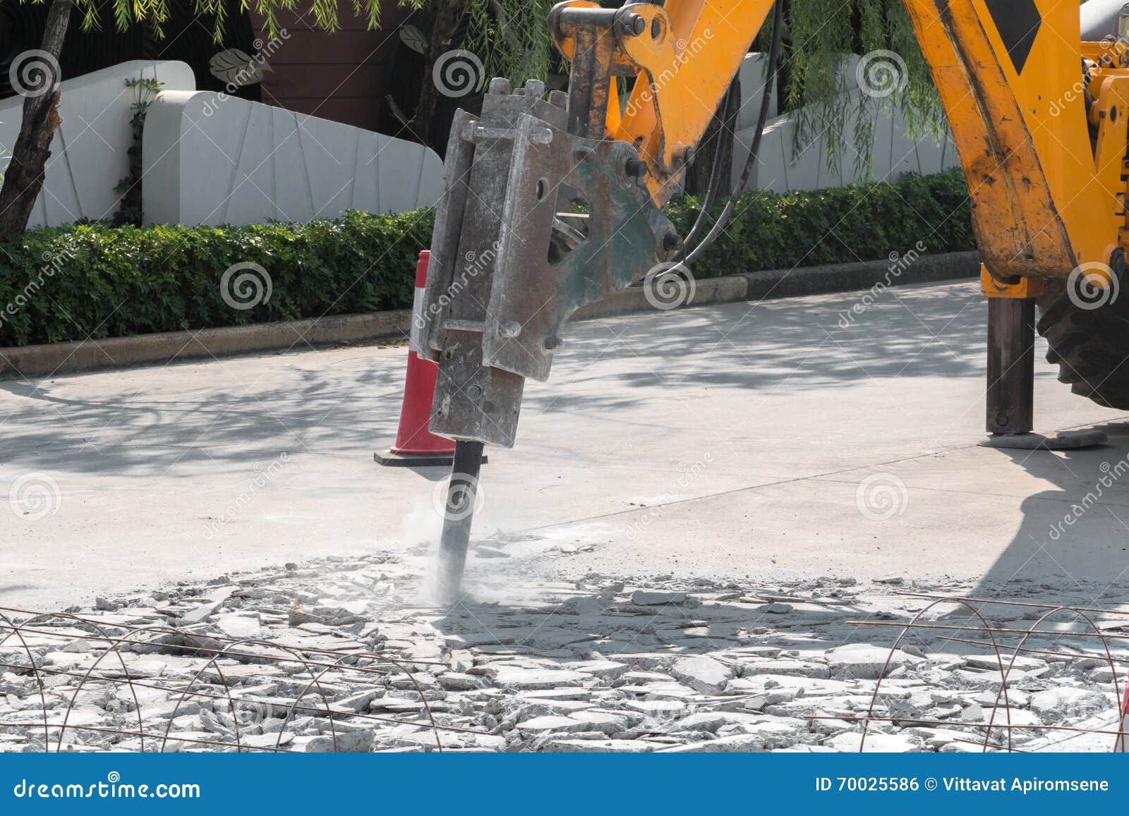 Excavator Breaking and Drilling the Concrete Road for Repairing Stock ...