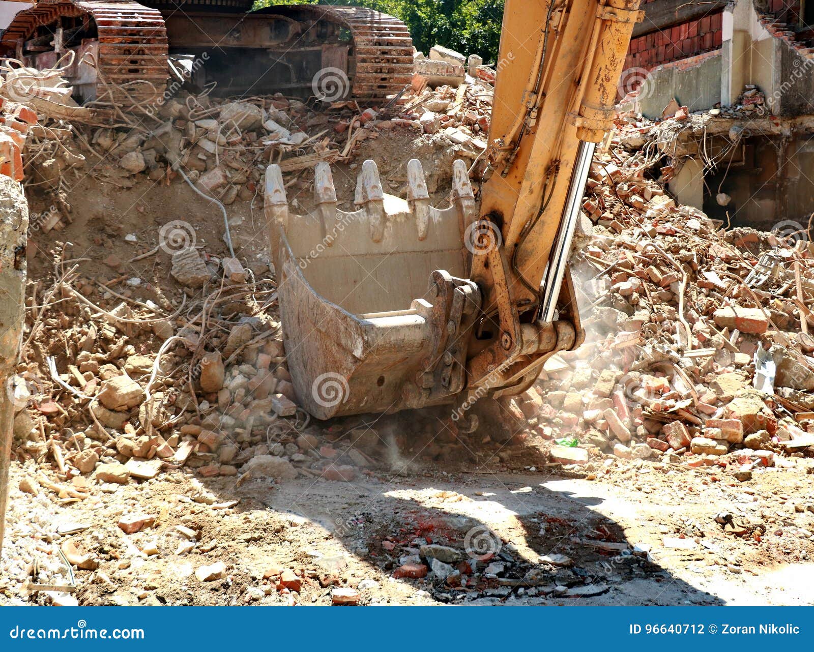 Excavator bucket dumping stock photo. Image of foundation - 96640712
