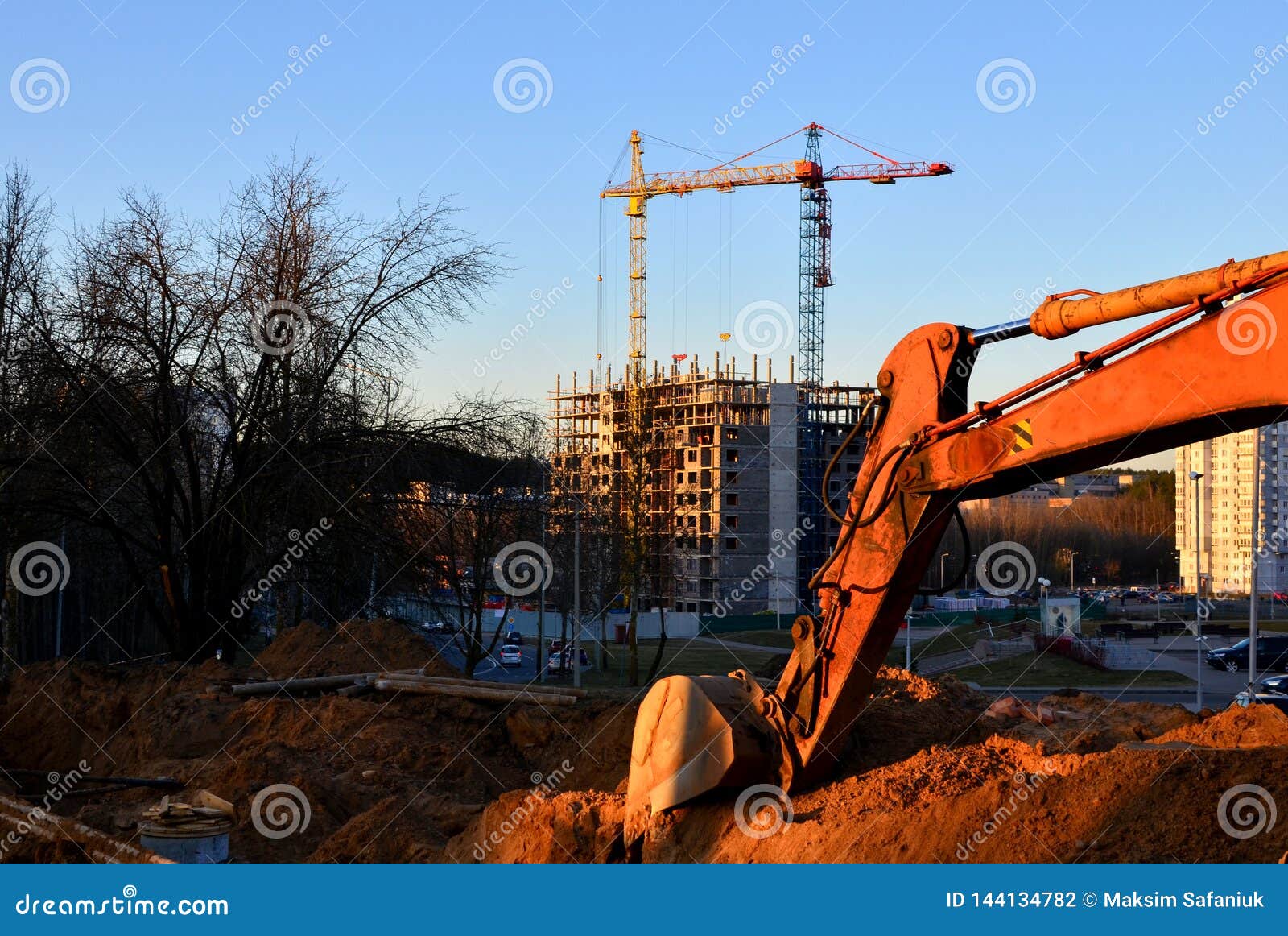 Excavator Bucket in the Ground at a Construction Site Stock Photo ...