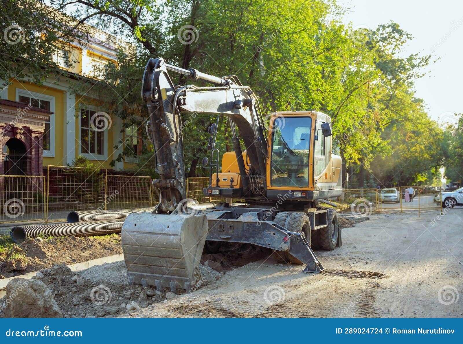 The Excavator Bucket is Lowered into the Ground Stock Photo - Image of ...