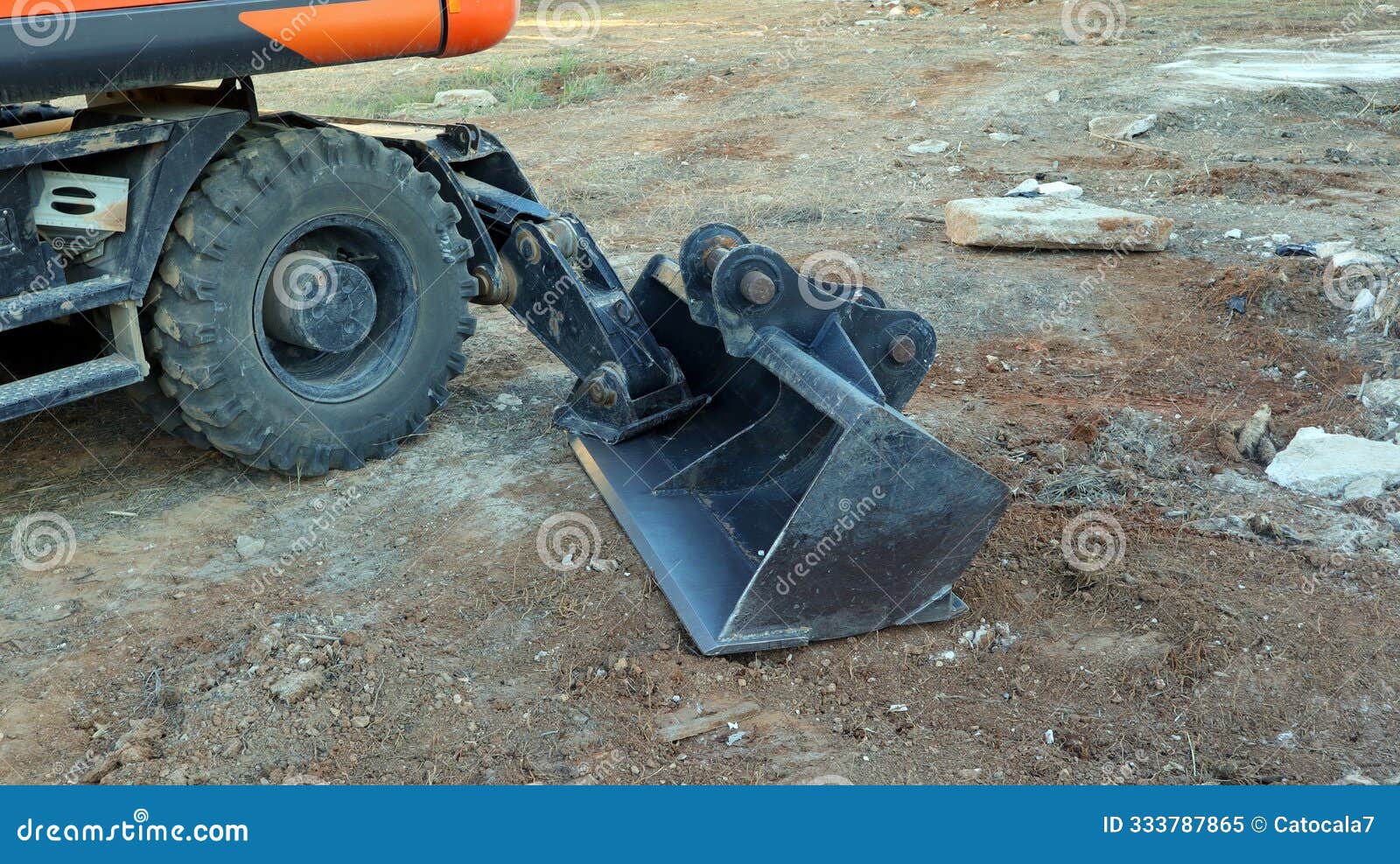An Excavator Bucket is Positioned on the Ground, Ready for Digging Work ...