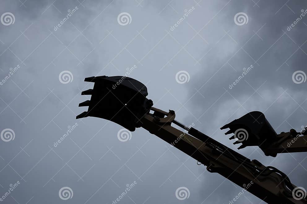 Excavator bucket raised stock photo. Image of vehicle - 112942456
