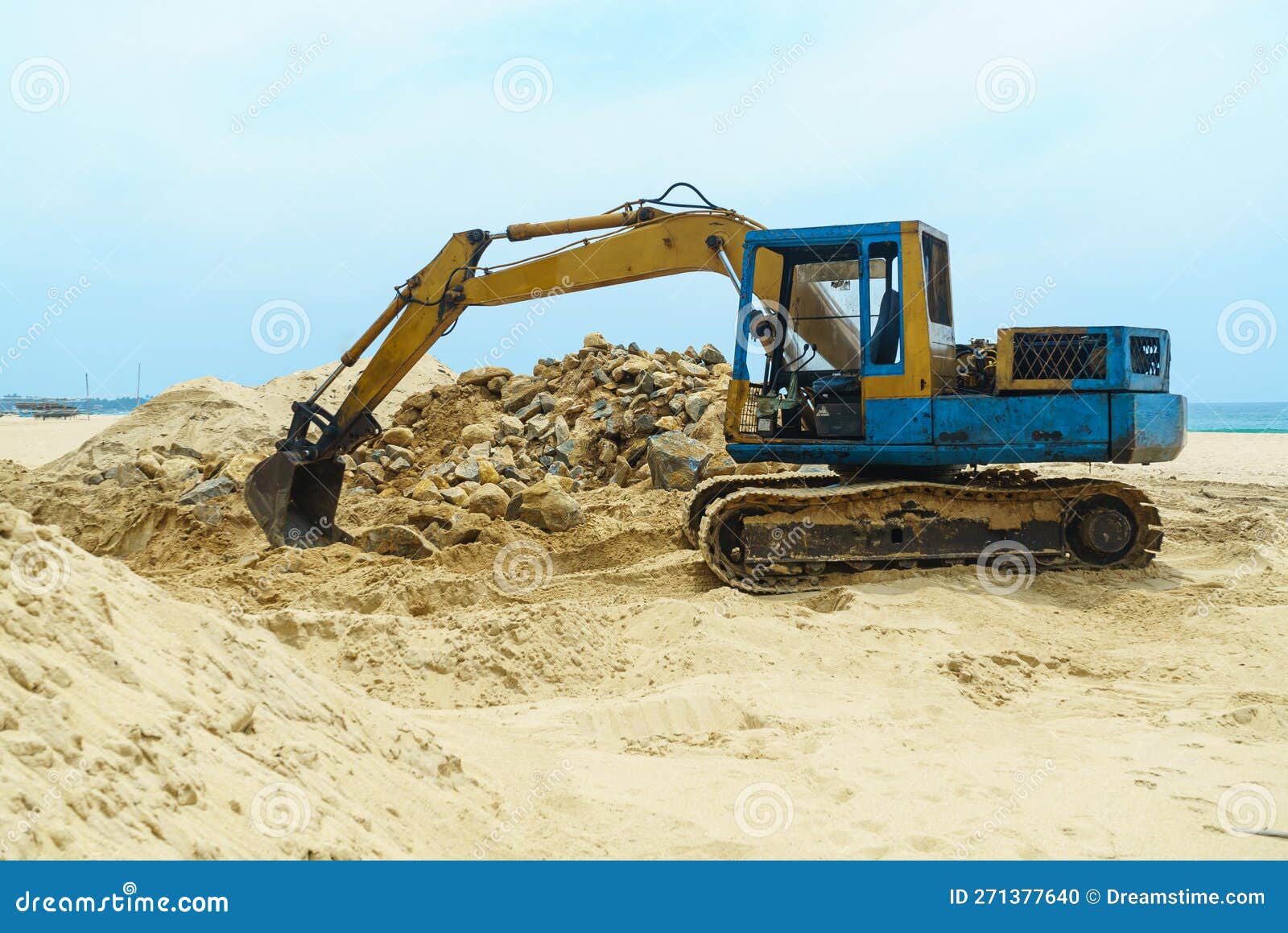 Excavator with a Bucket Stands on the Sand on the Beach Stock Photo ...