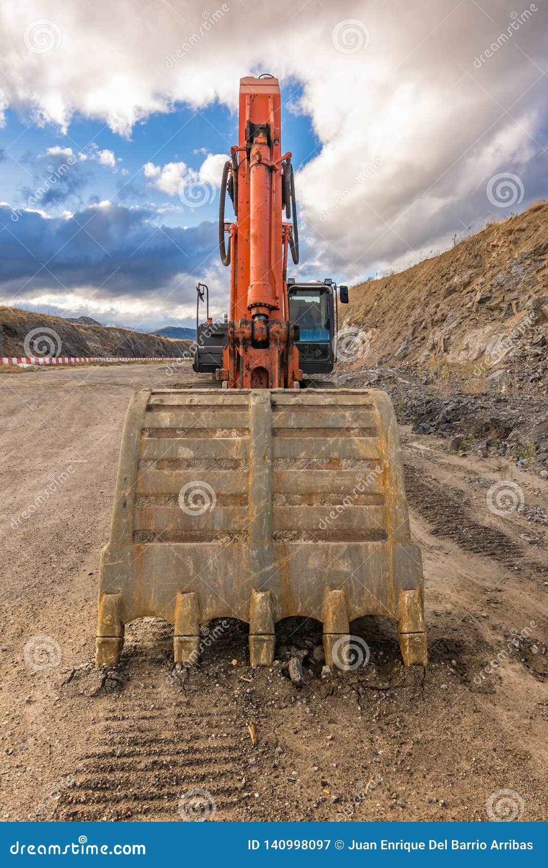 Excavator Building a Road Next To a Slope Stock Image - Image of blue ...