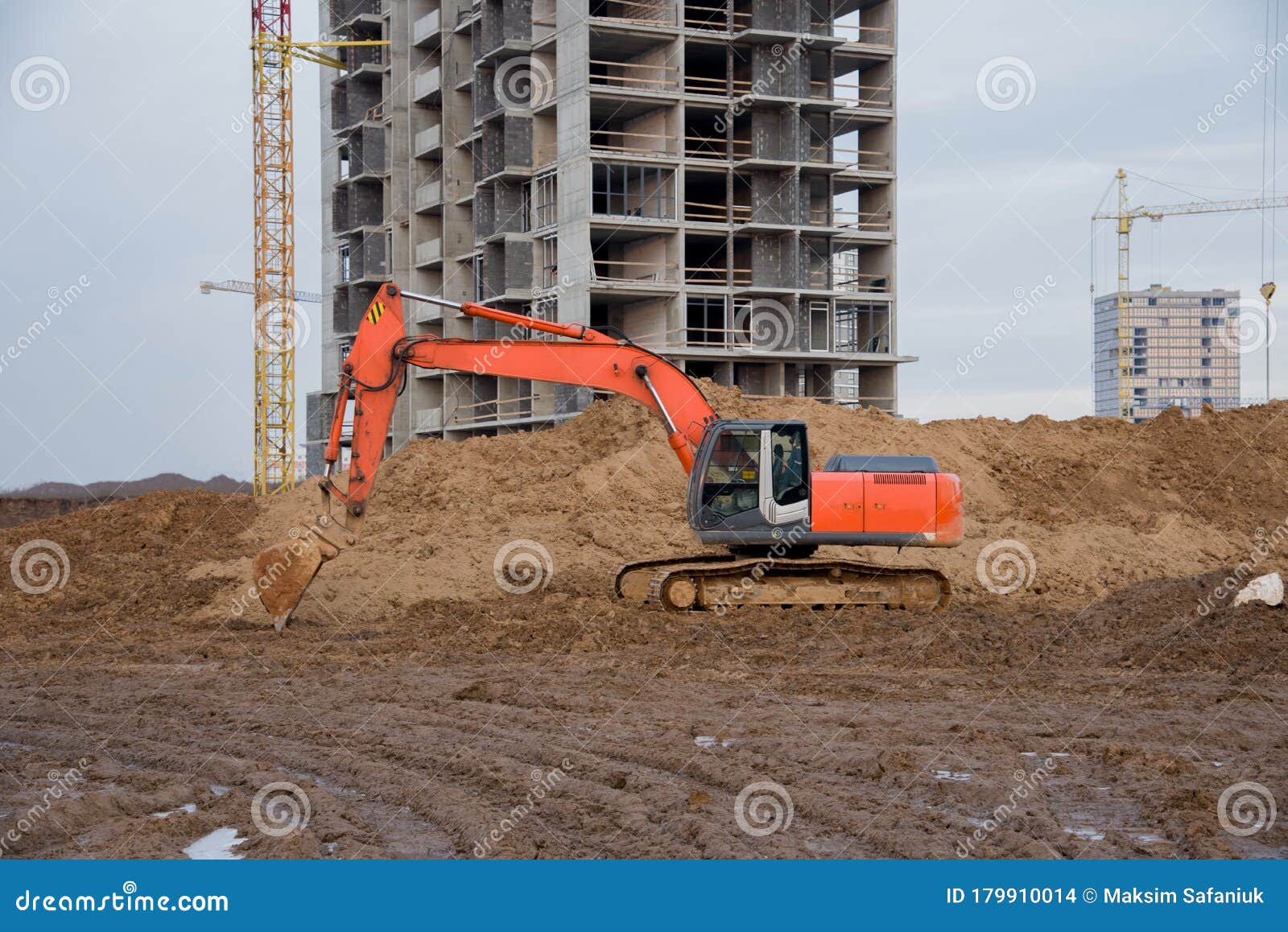 Excavator at Building Under Construction. Backhoe Digs the Ground for ...