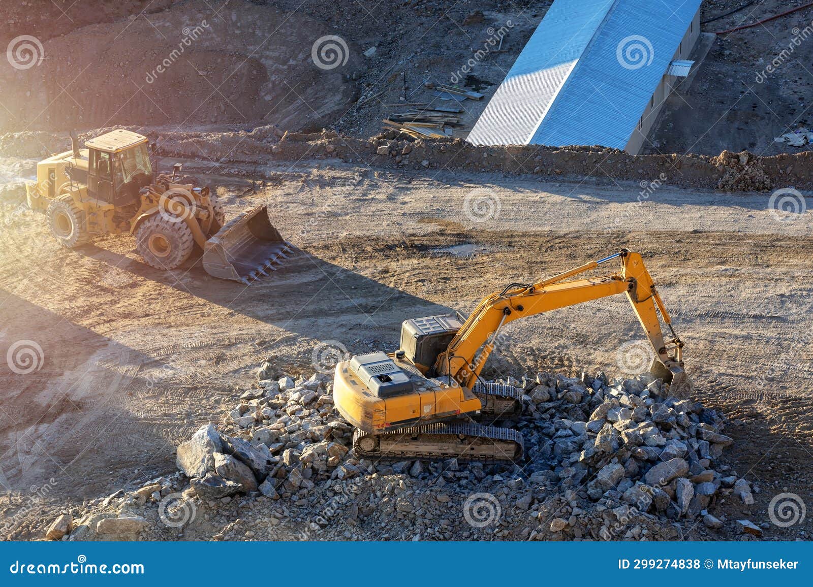 Excavator and Bulldozer in Construction Site. Excavation is the Process ...
