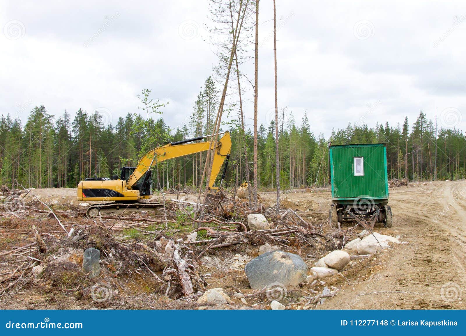 Excavator and Cabins for Forestry Workers on a Forest Felling Plot ...