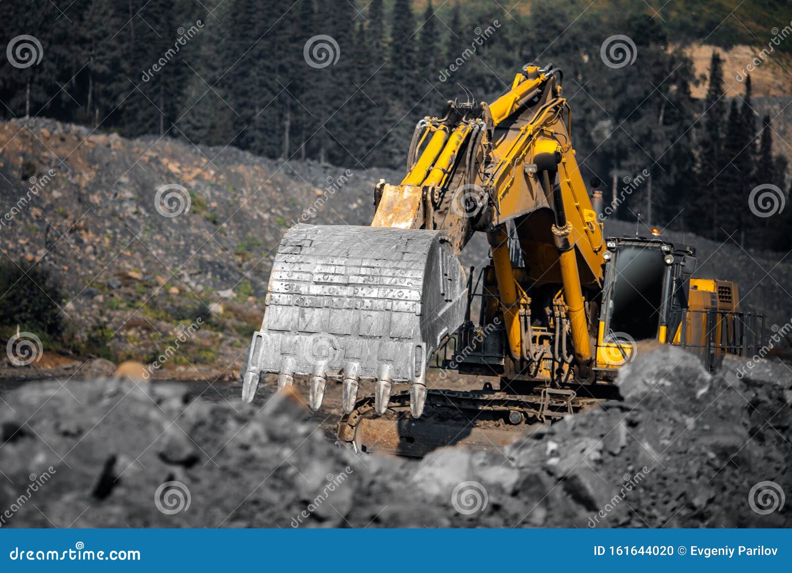 Excavator Cleans Large Soil Stones after Rock Explosion Blasting. Open ...