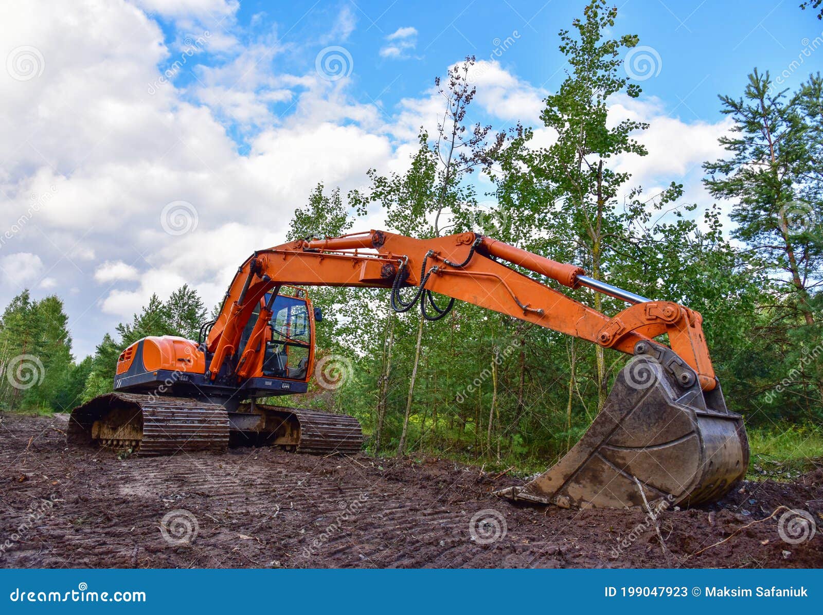 Excavator Clearing Forest for New Development. Orange Backhoe Modified ...
